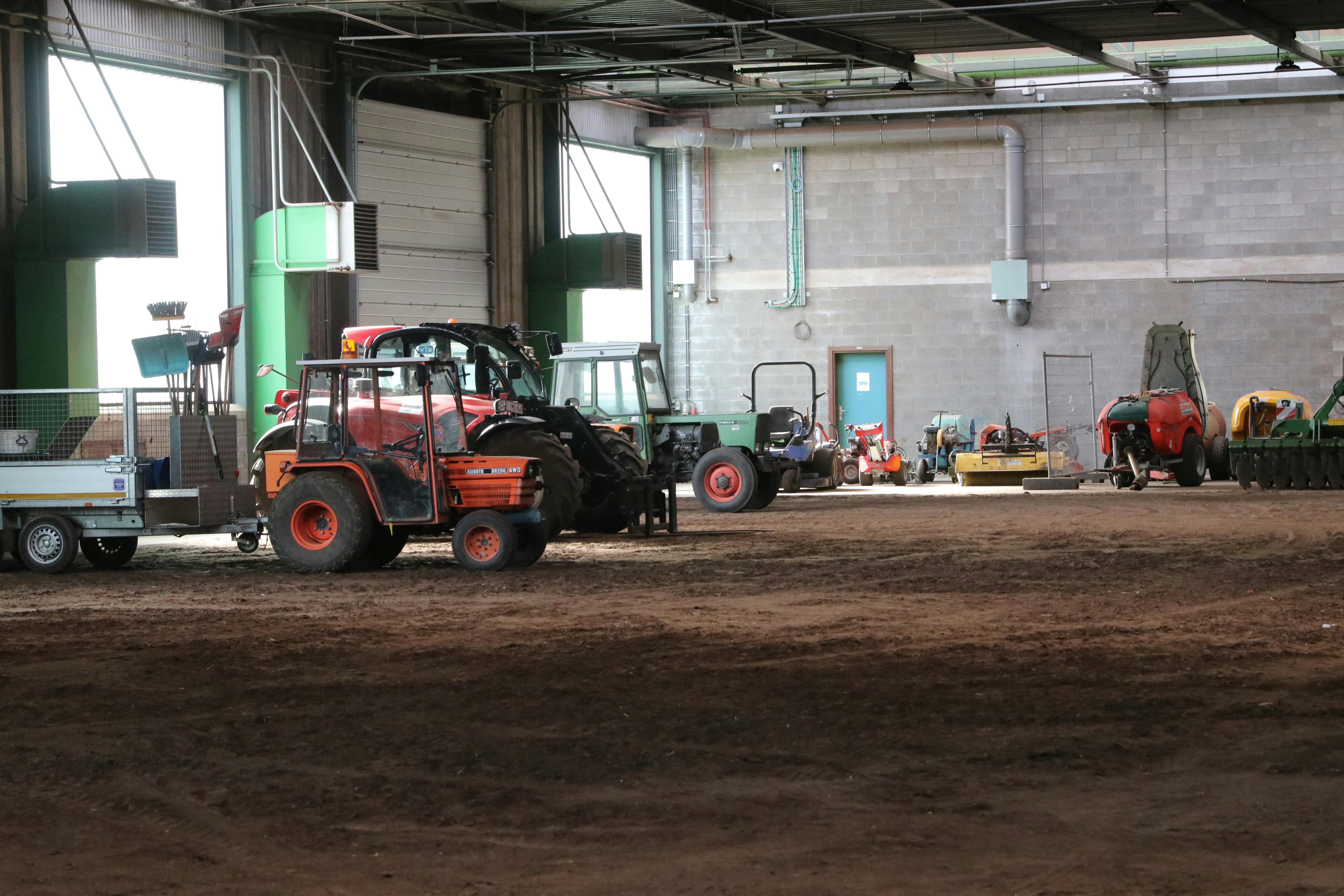 Tractors in Farm Building · Free Stock Photo