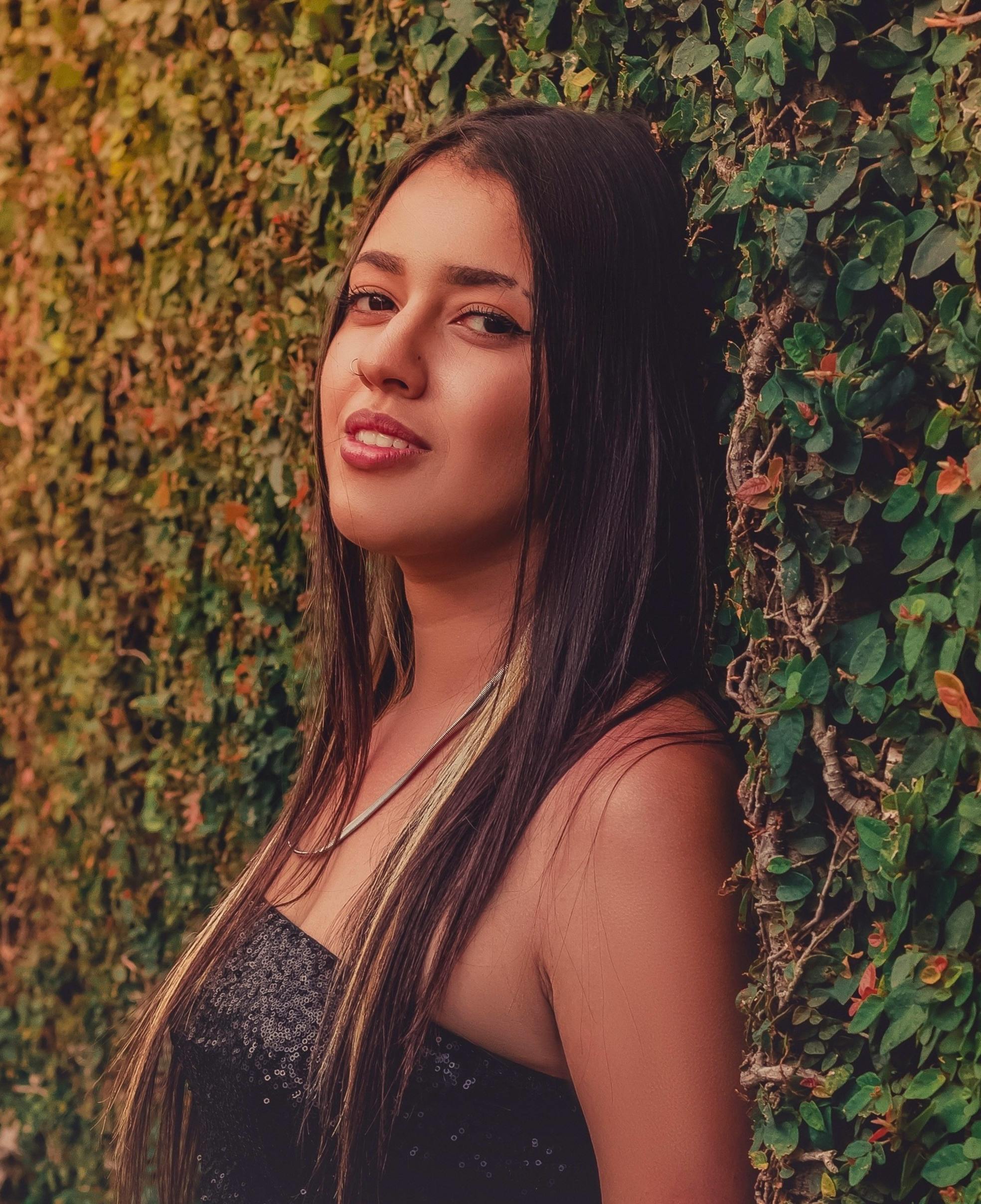 Sunlit Face of Posing Woman · Free Stock Photo