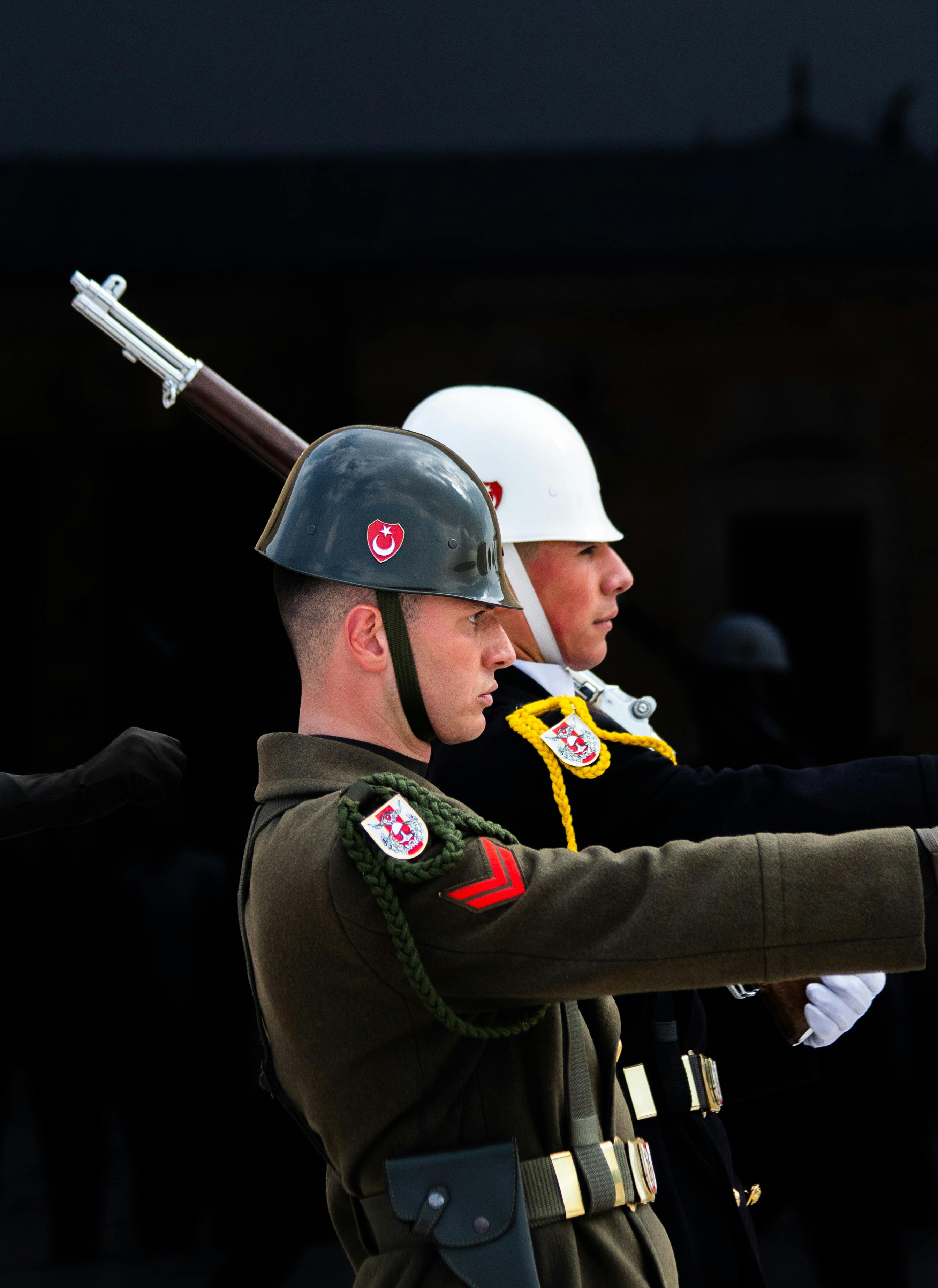 A Man in Brown Uniform Holding a Sword · Free Stock Photo