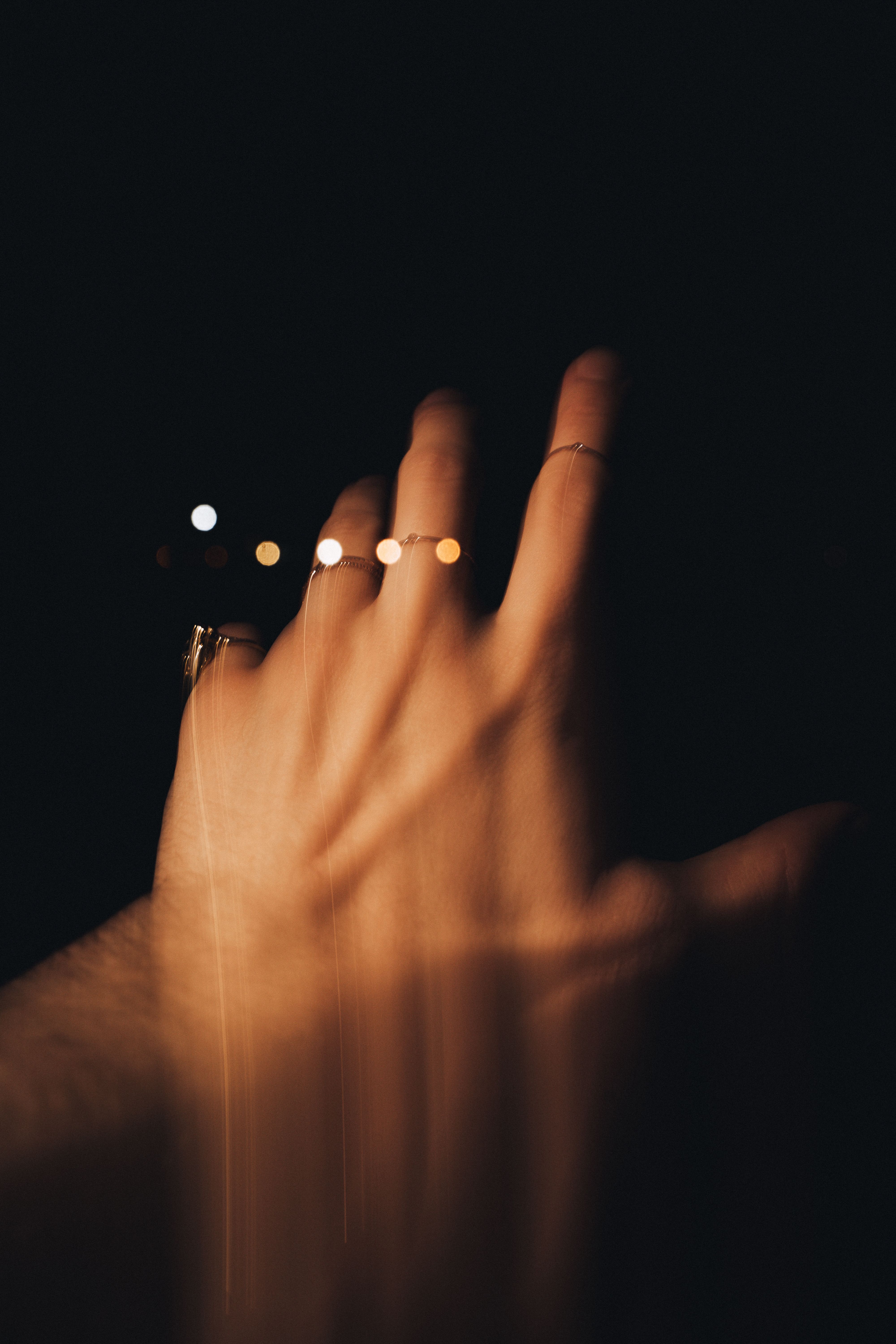 Close up of Blurred Hand with Rings · Free Stock Photo
