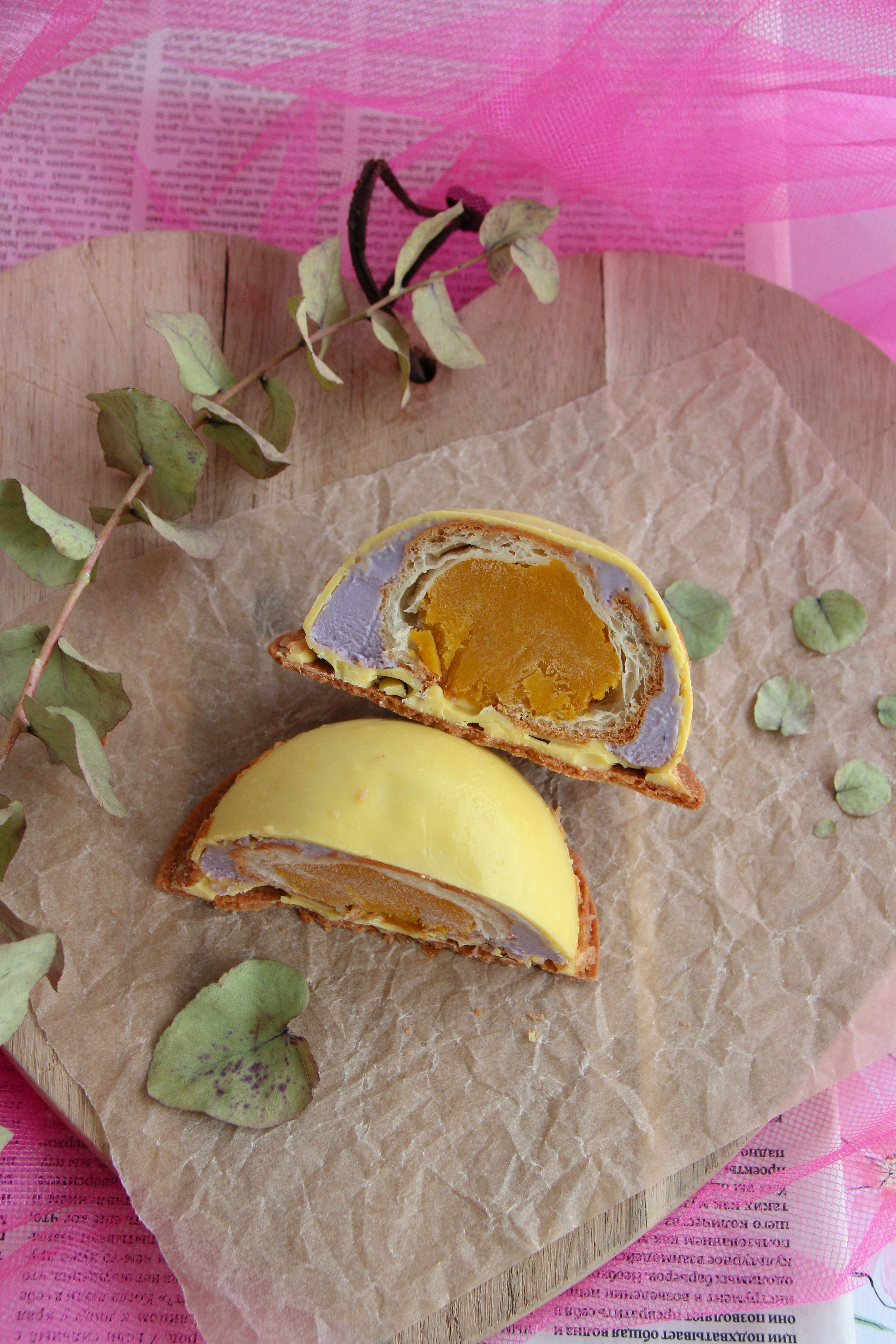 Pastry Cut in Half on a Baking Paper · Free Stock Photo