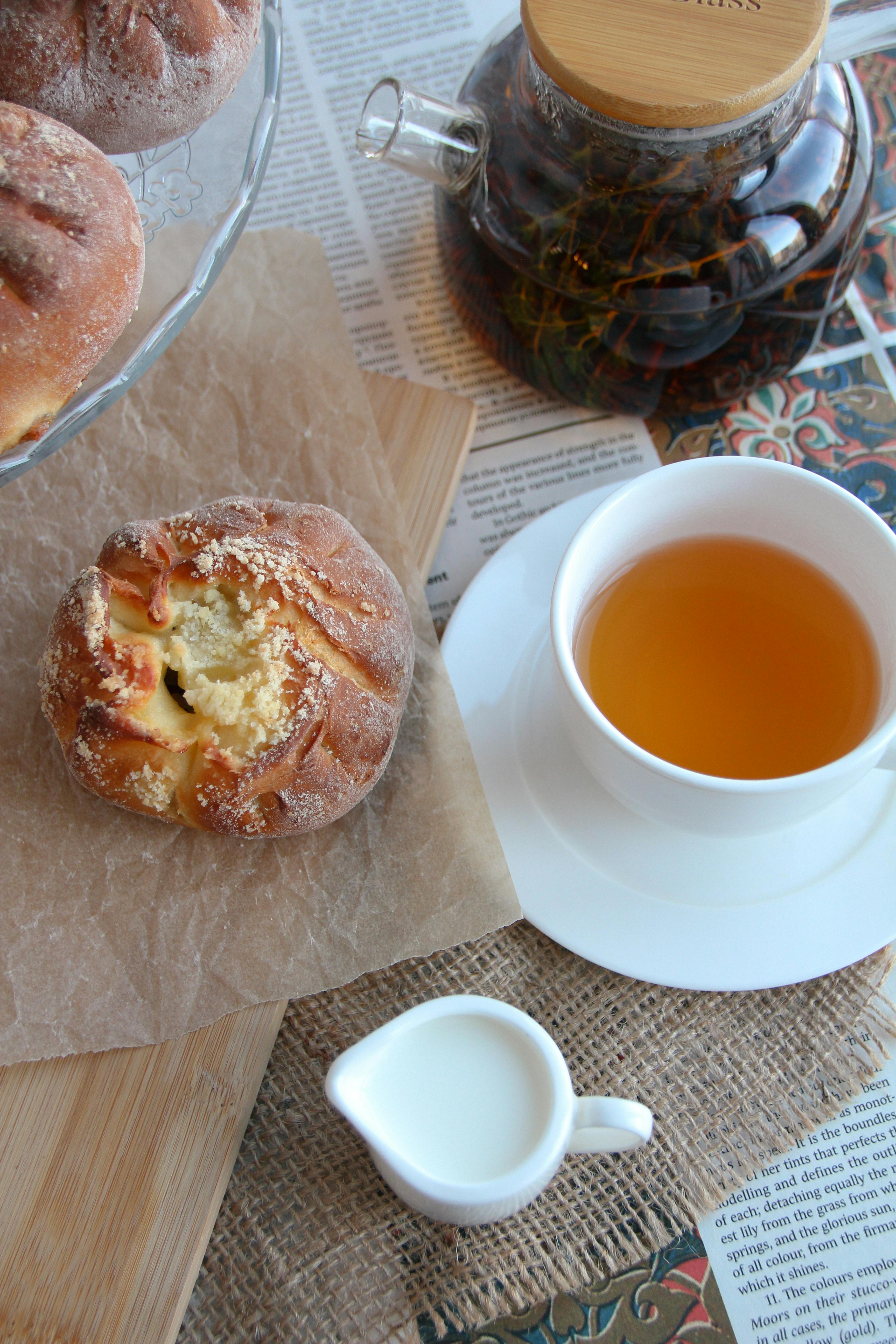 A Sweet Bun and a Cup of Tea · Free Stock Photo