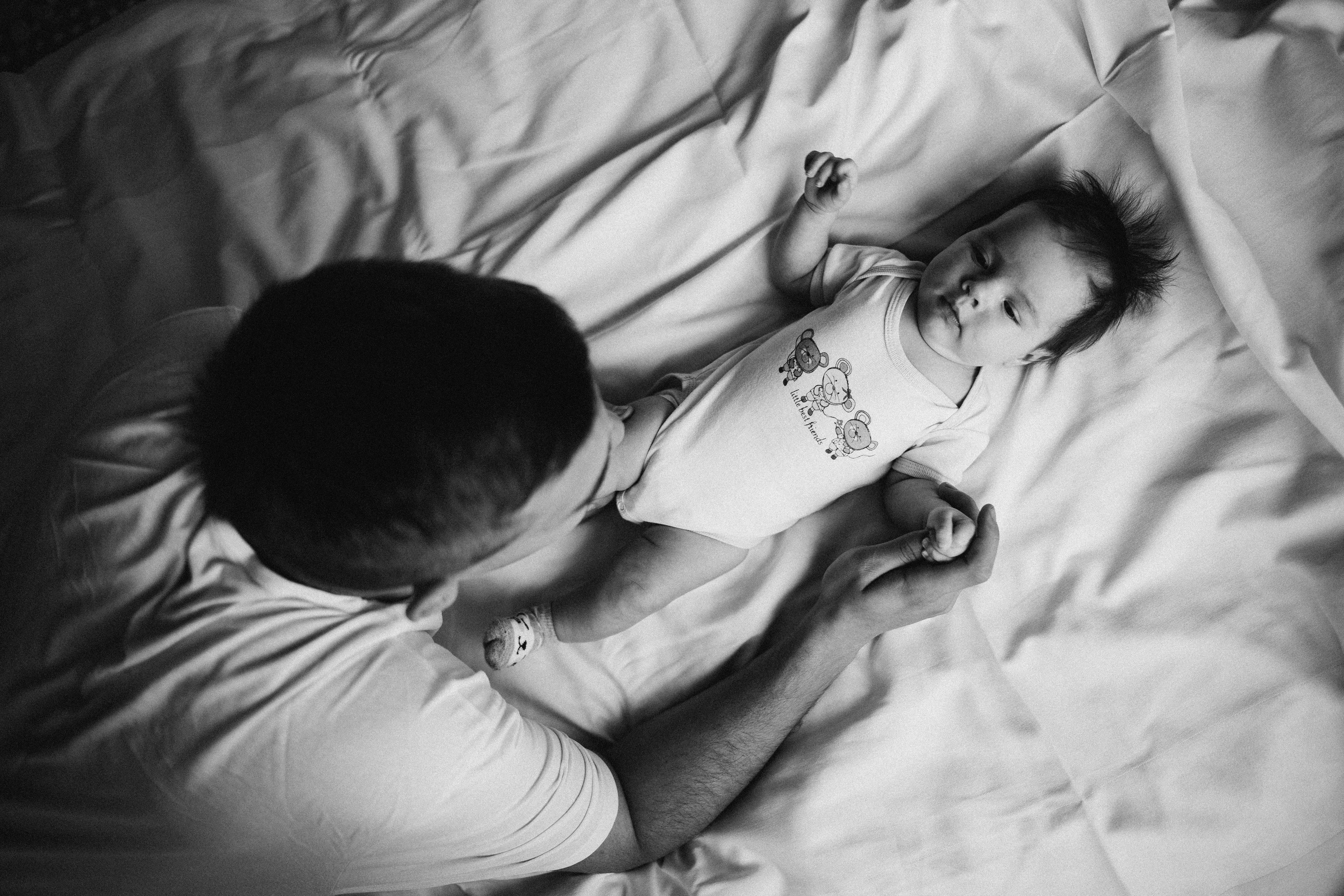 Photo Of Man Carrying Newborn Baby · Free Stock Photo