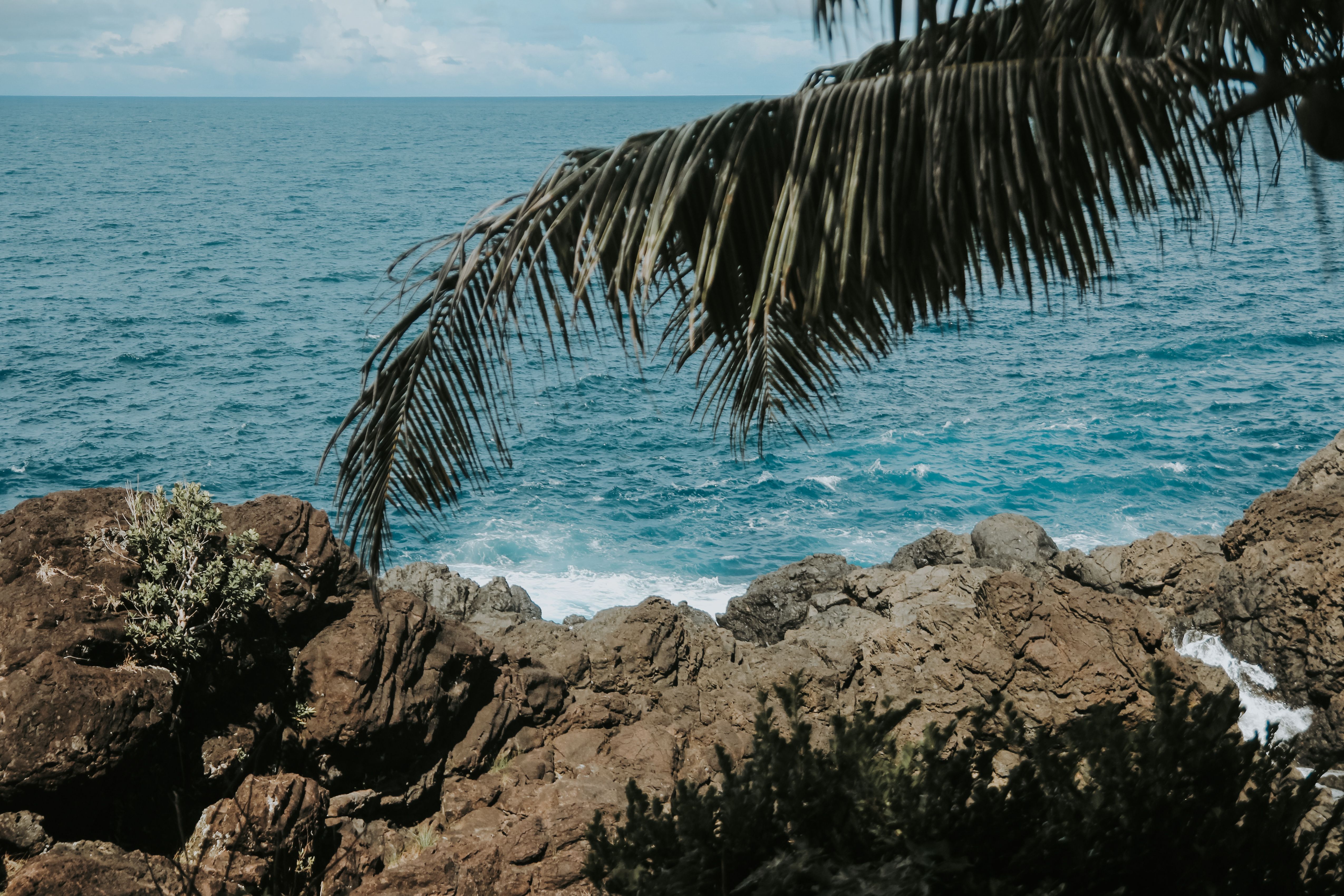 Lagoon and Beach Surrounded by Rock Formation · Free Stock Photo