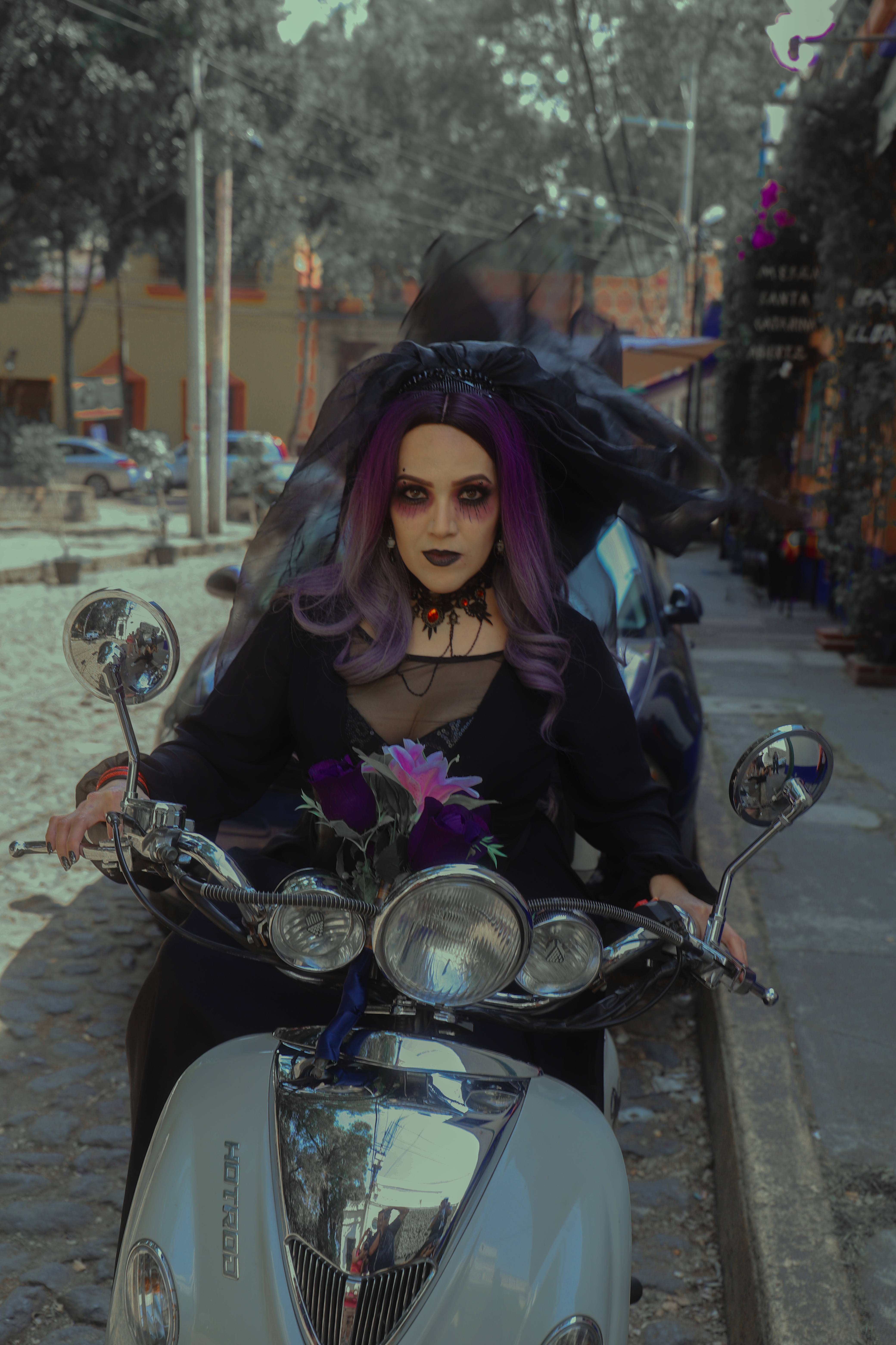 Woman in a Halloween Costume, Makeup and a Purple Wig Sitting on a ...