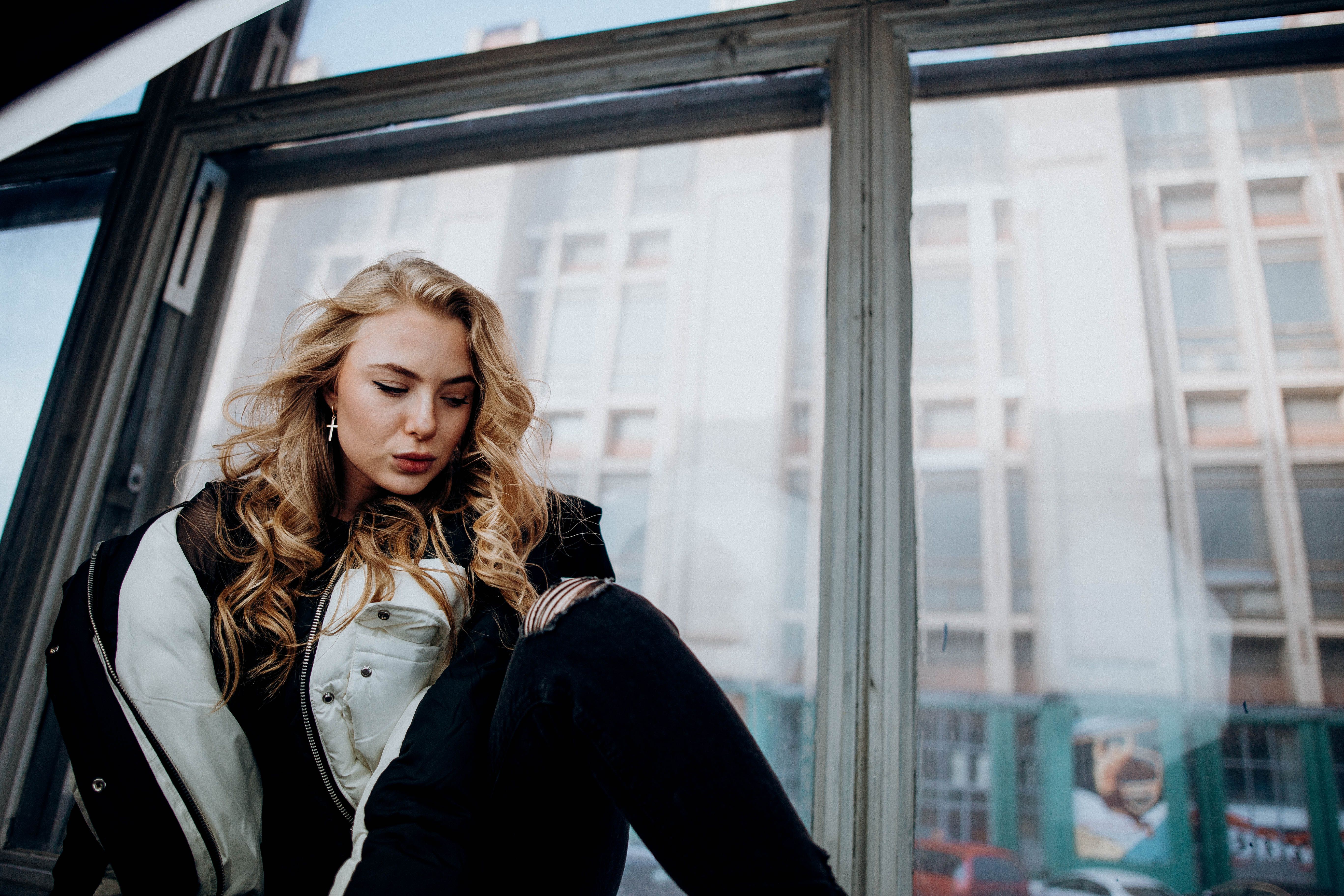 Blonde Woman Posing near Windows · Free Stock Photo