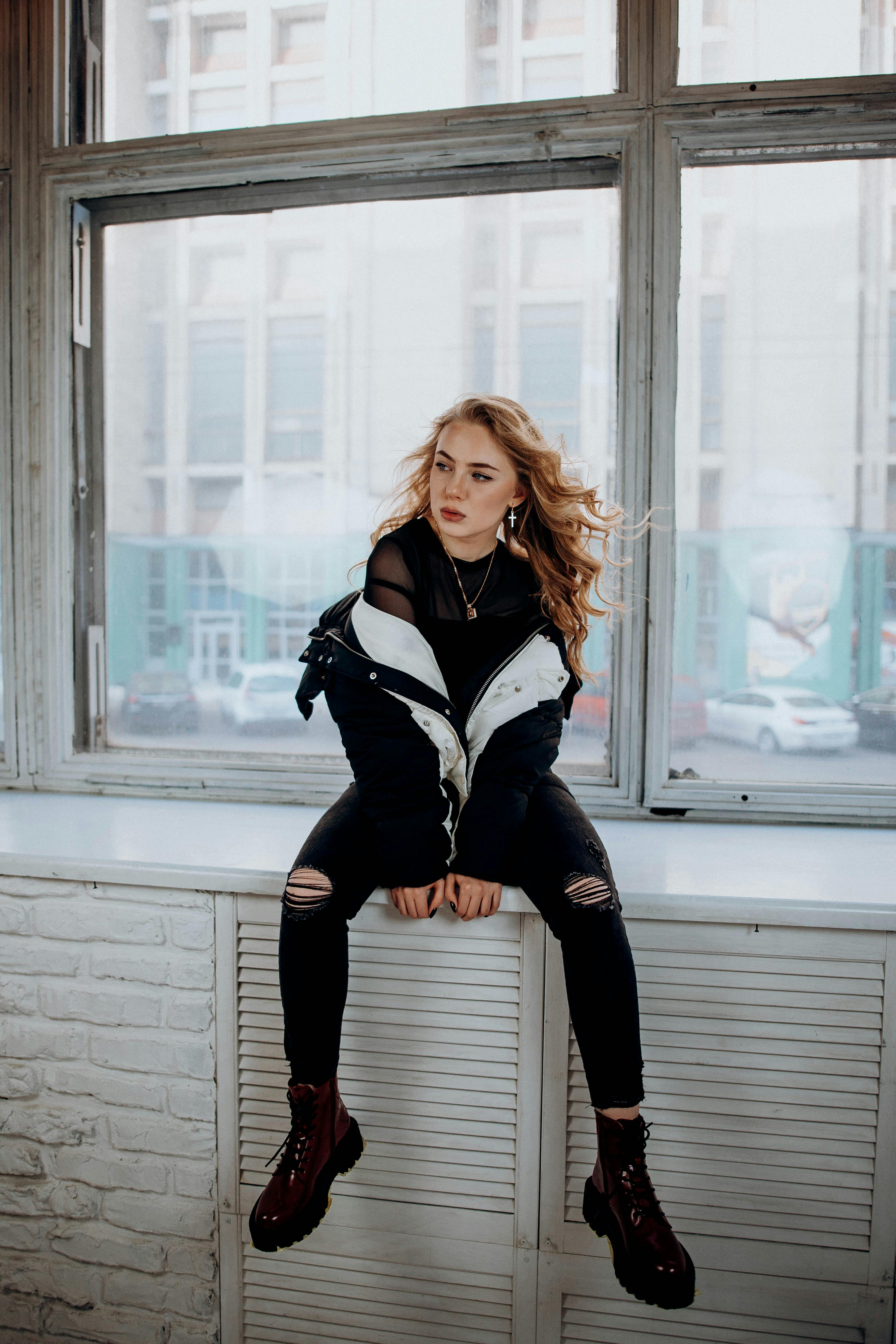 Woman Sitting and Posing on Windowsill · Free Stock Photo