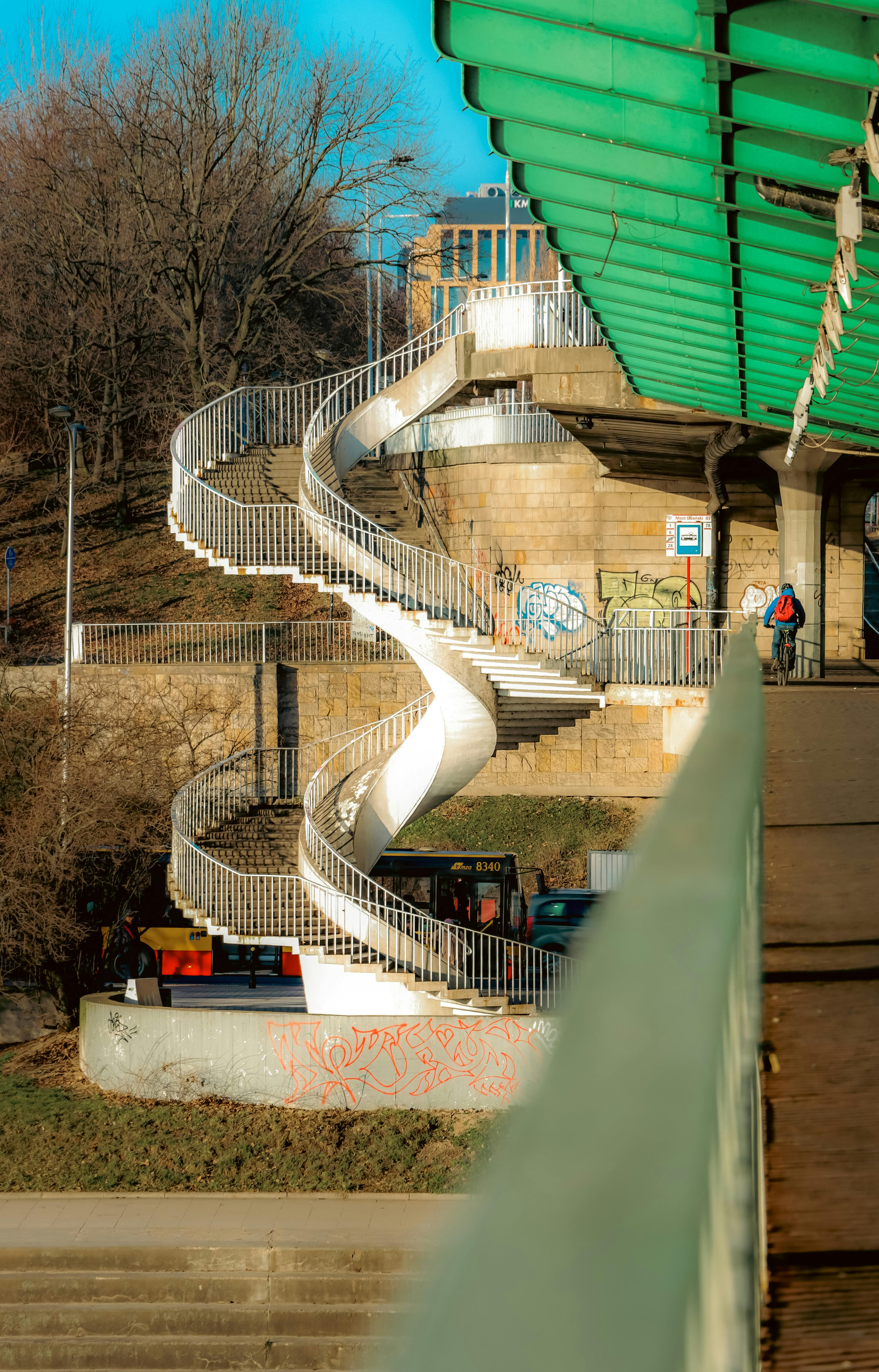 Photo of a Spiral Staircase by a Bridge · Free Stock Photo