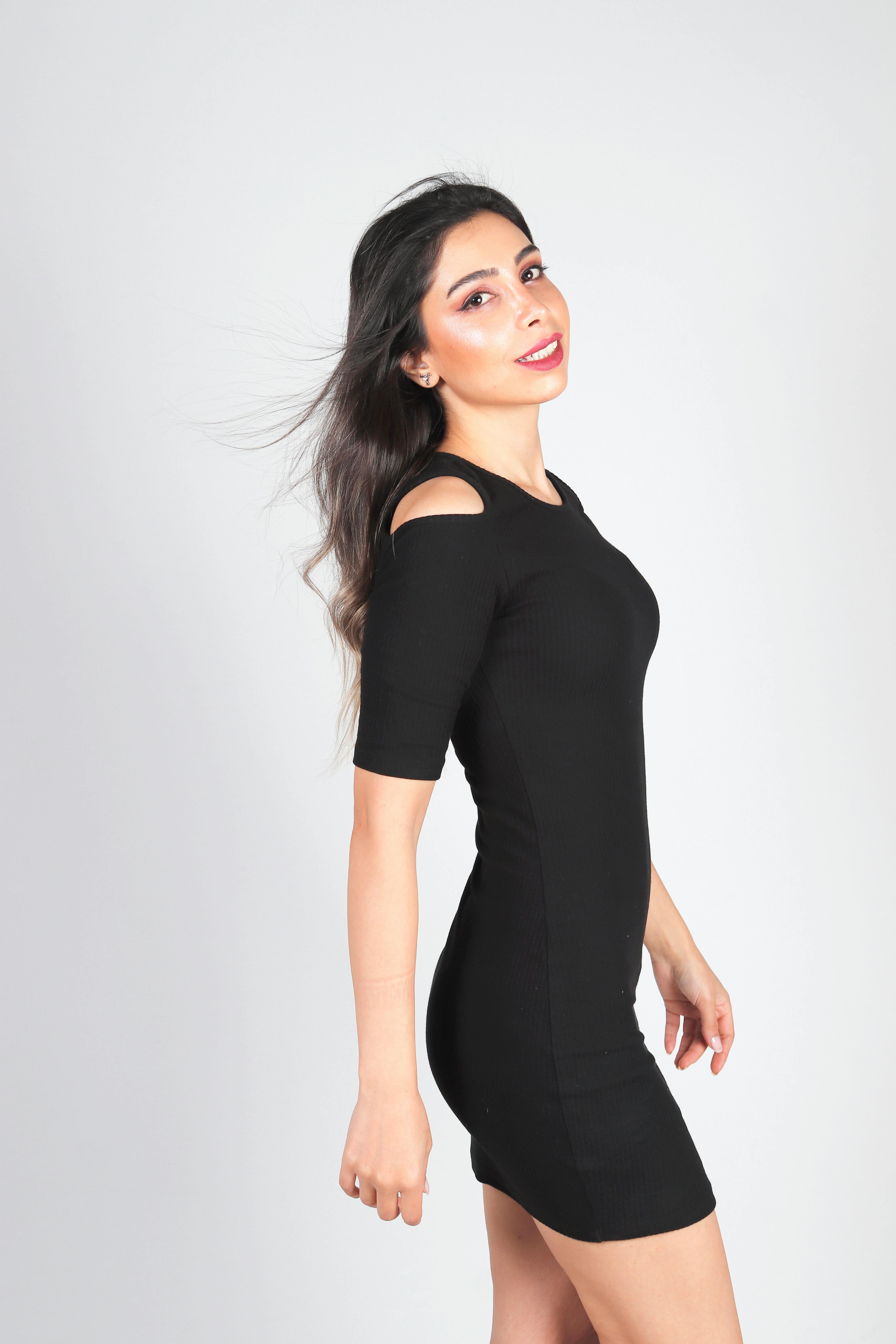 Woman Posing by Wall · Free Stock Photo