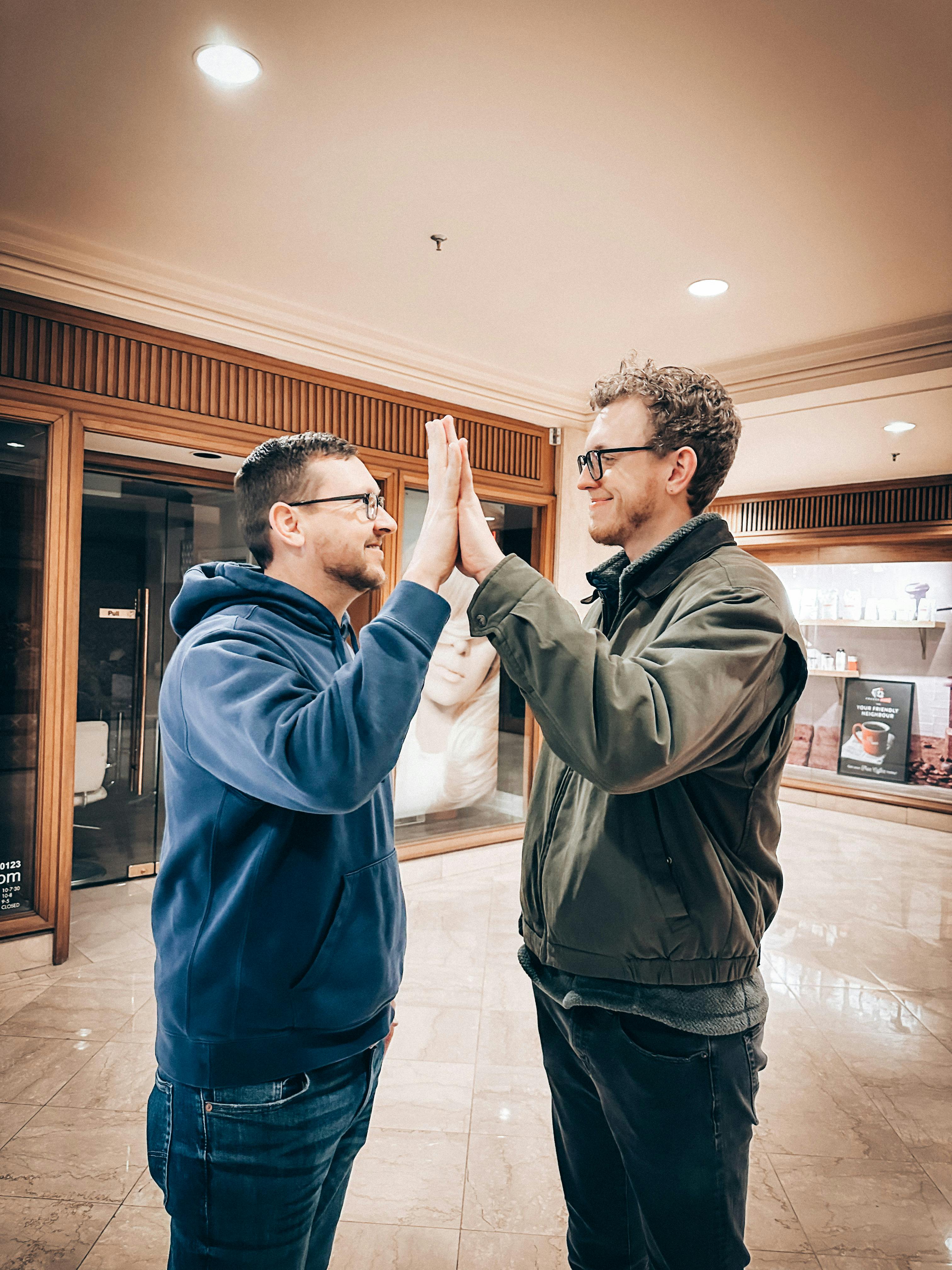 Two Men Giving a High Five · Free Stock Photo