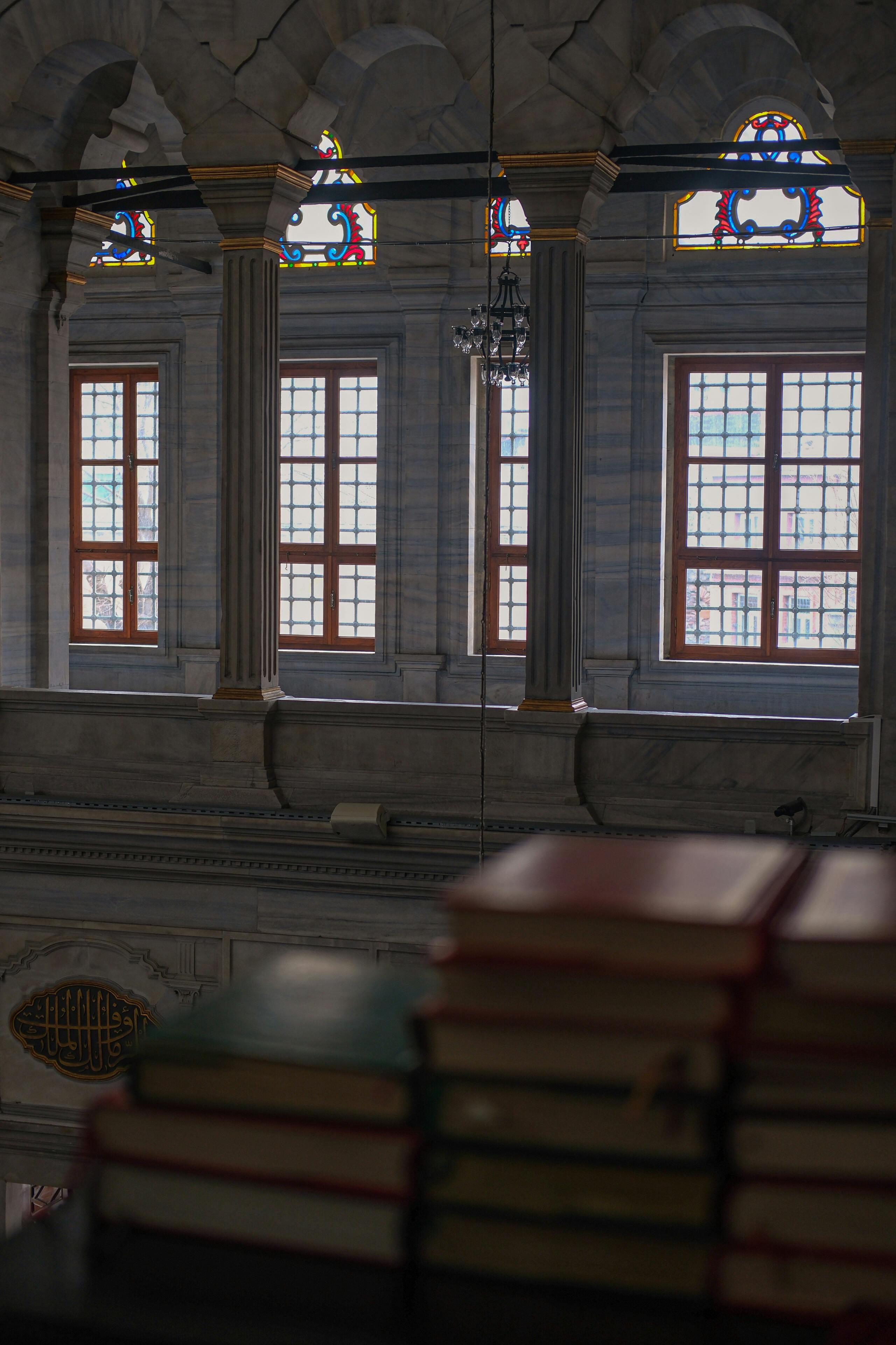 Koran on Wooden Shelf in Mosque · Free Stock Photo