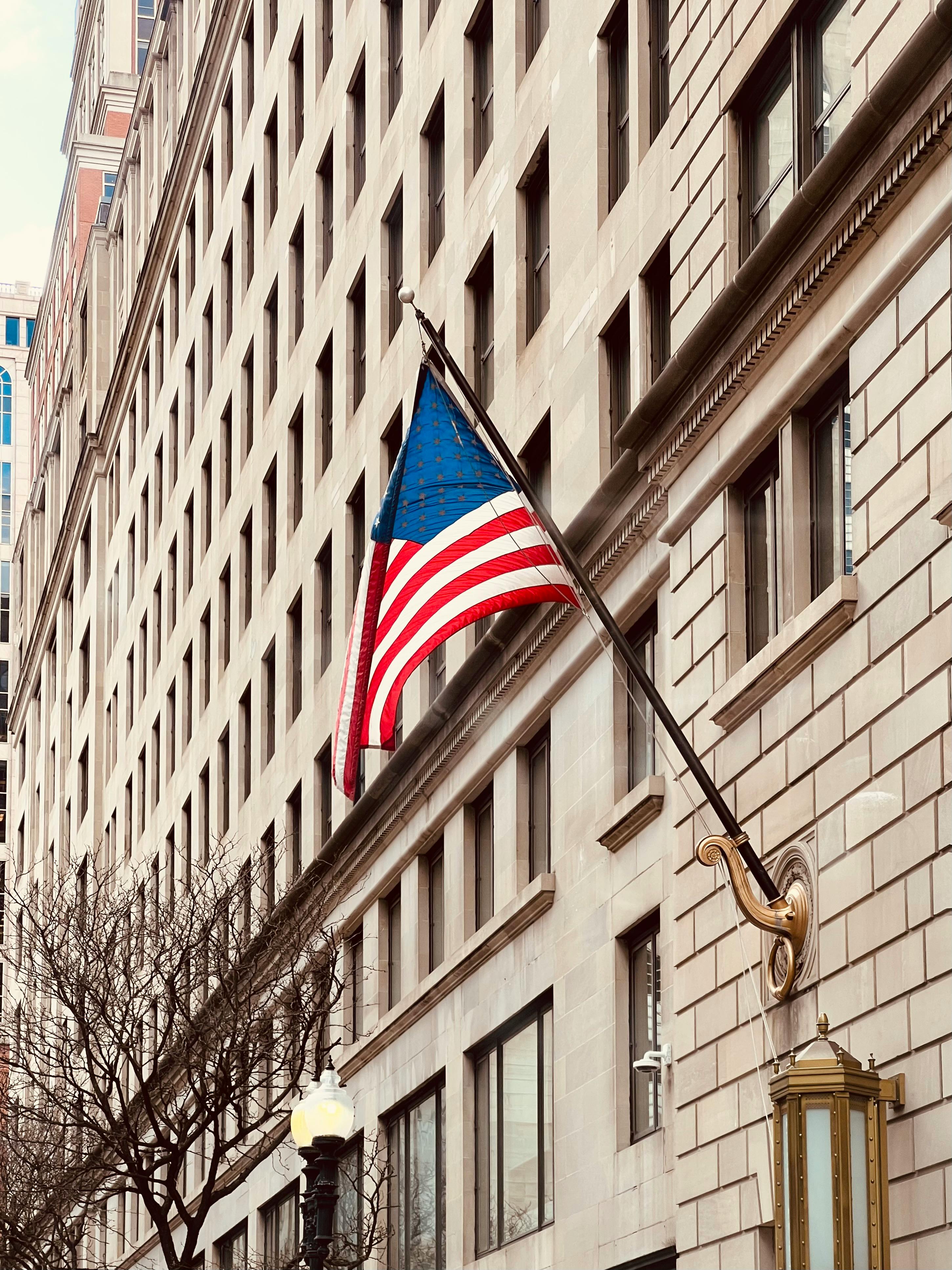 American Flag on Building Wall · Free Stock Photo