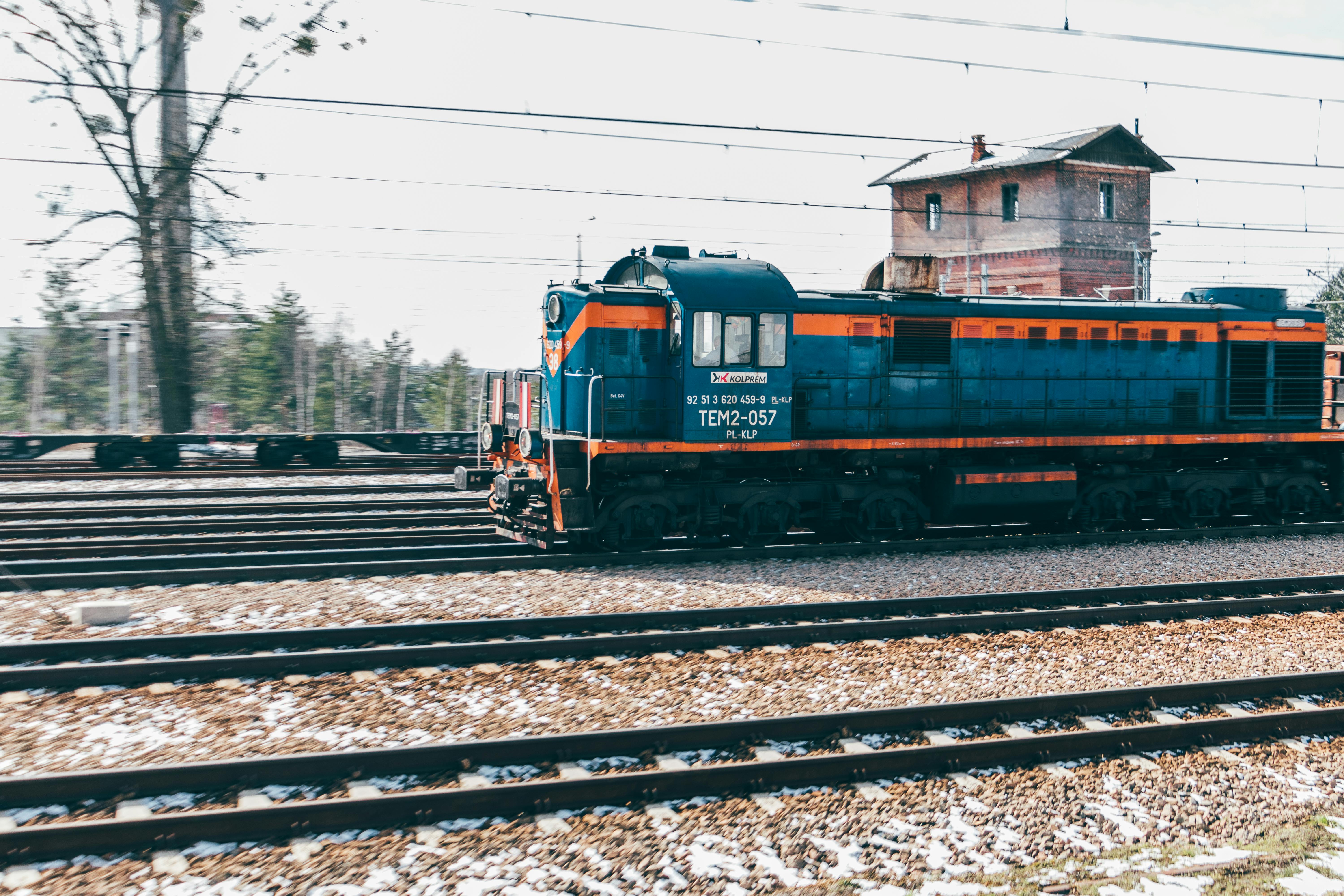 Blue Locomotive on Railway Tracks · Free Stock Photo