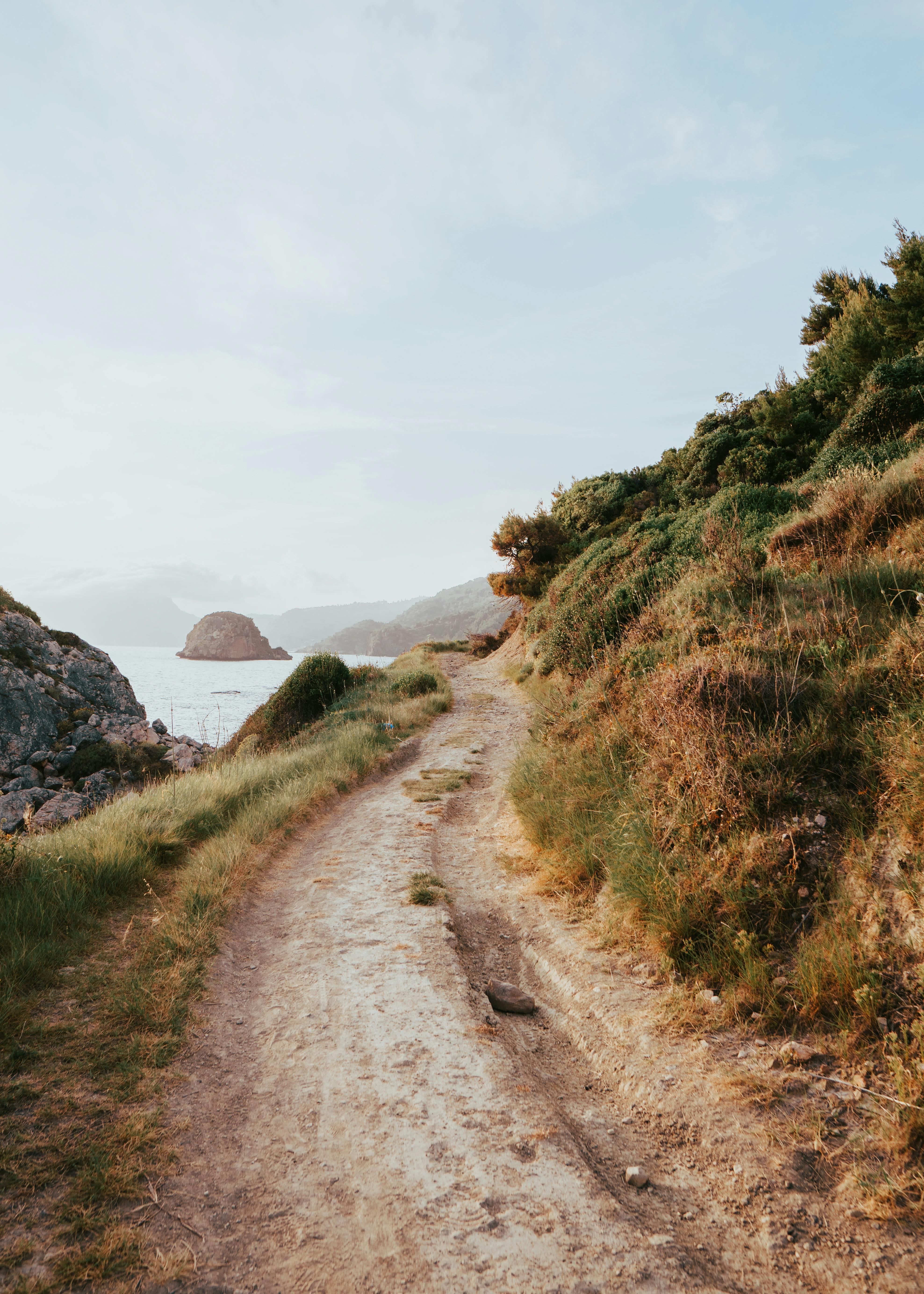 A Road on a Hill by the Sea · Free Stock Photo