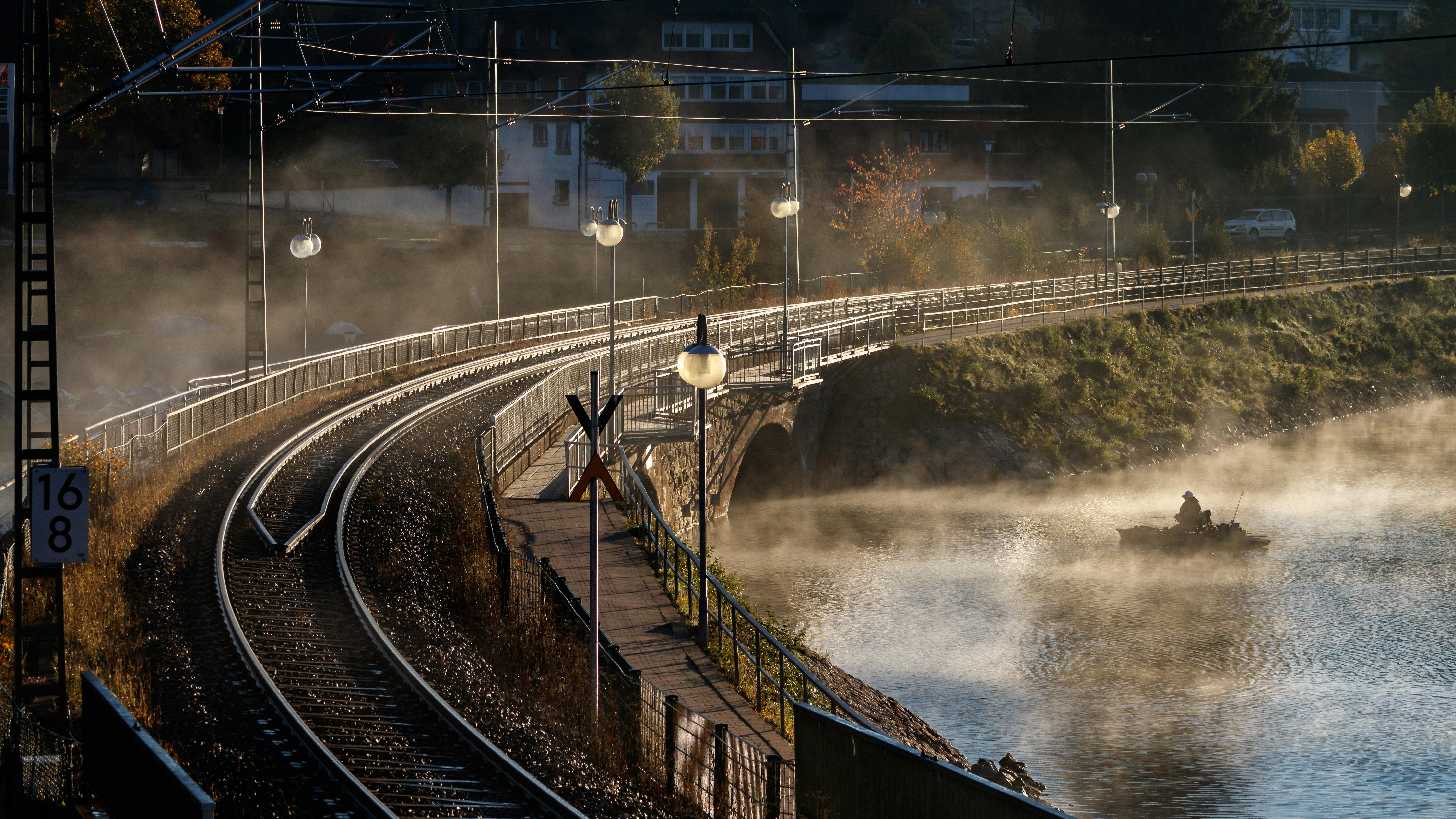 Grey Concrete Bridge Above Water Under Blue Sky · Free Stock Photo