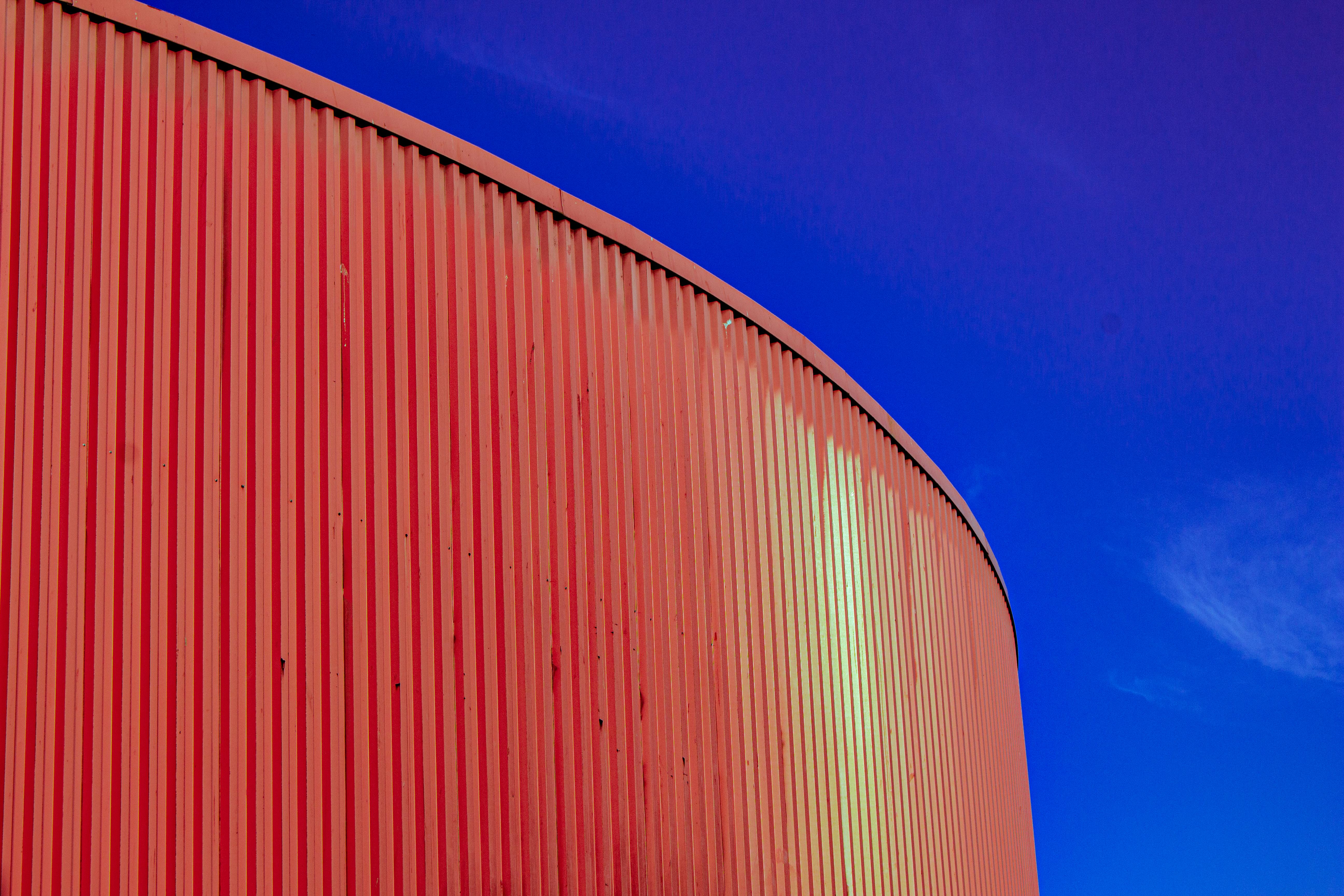 Blue Sky over Red Building Wall · Free Stock Photo