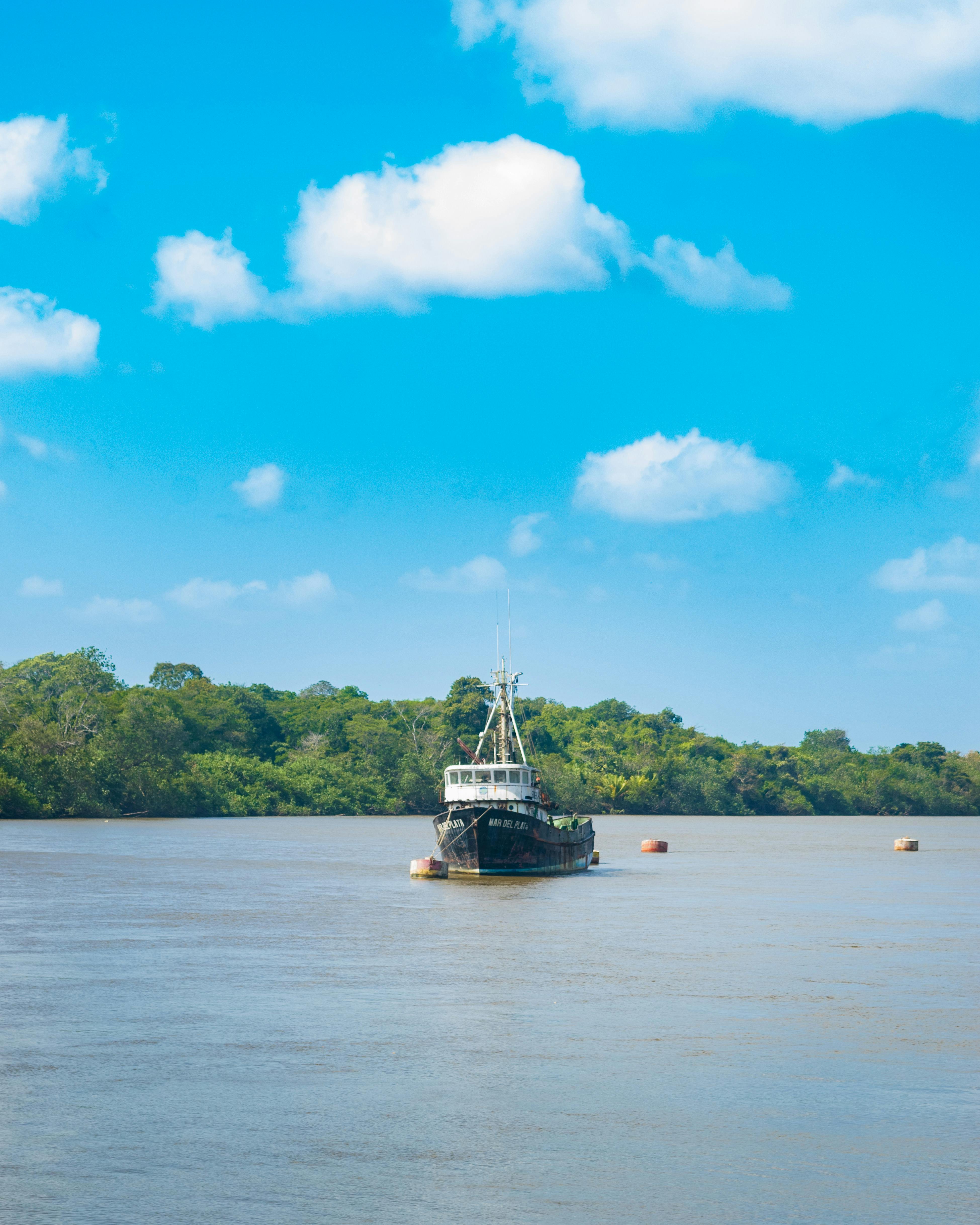 Clouds on Blue Sky over Trawler on River · Free Stock Photo
