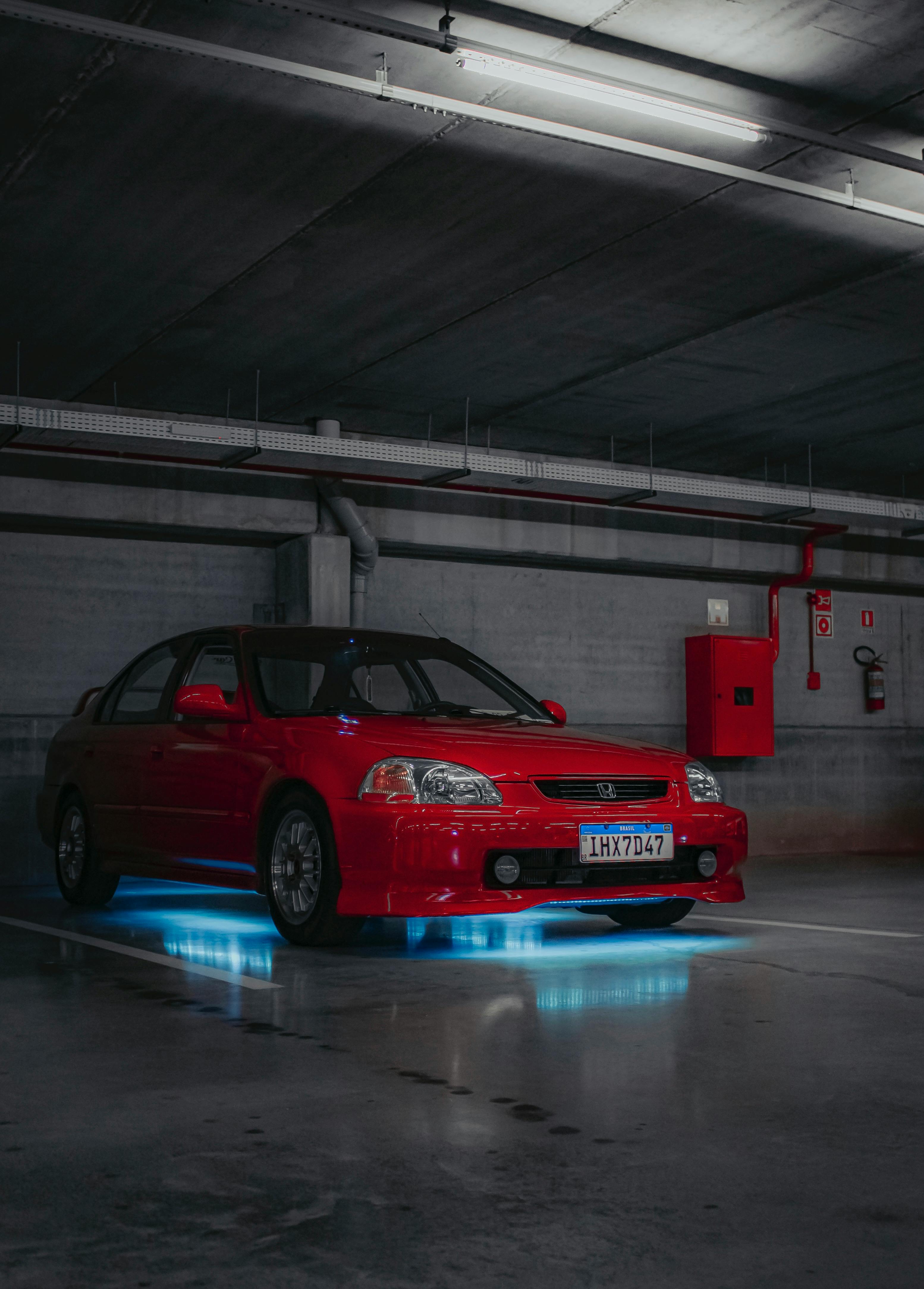 A Red Car in the Parking Lot · Free Stock Photo