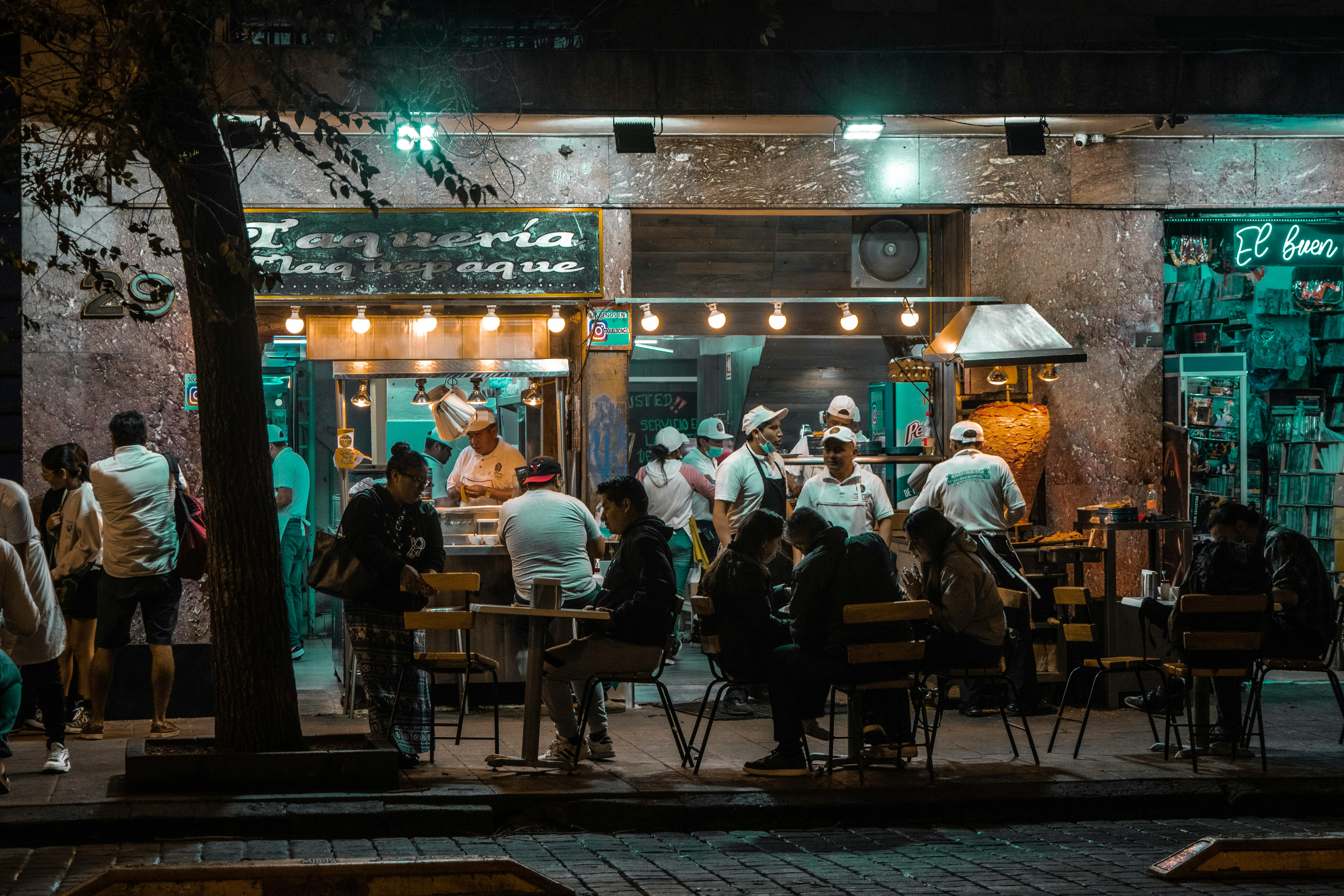 People Eating at Snack Bar Restaurant · Free Stock Photo