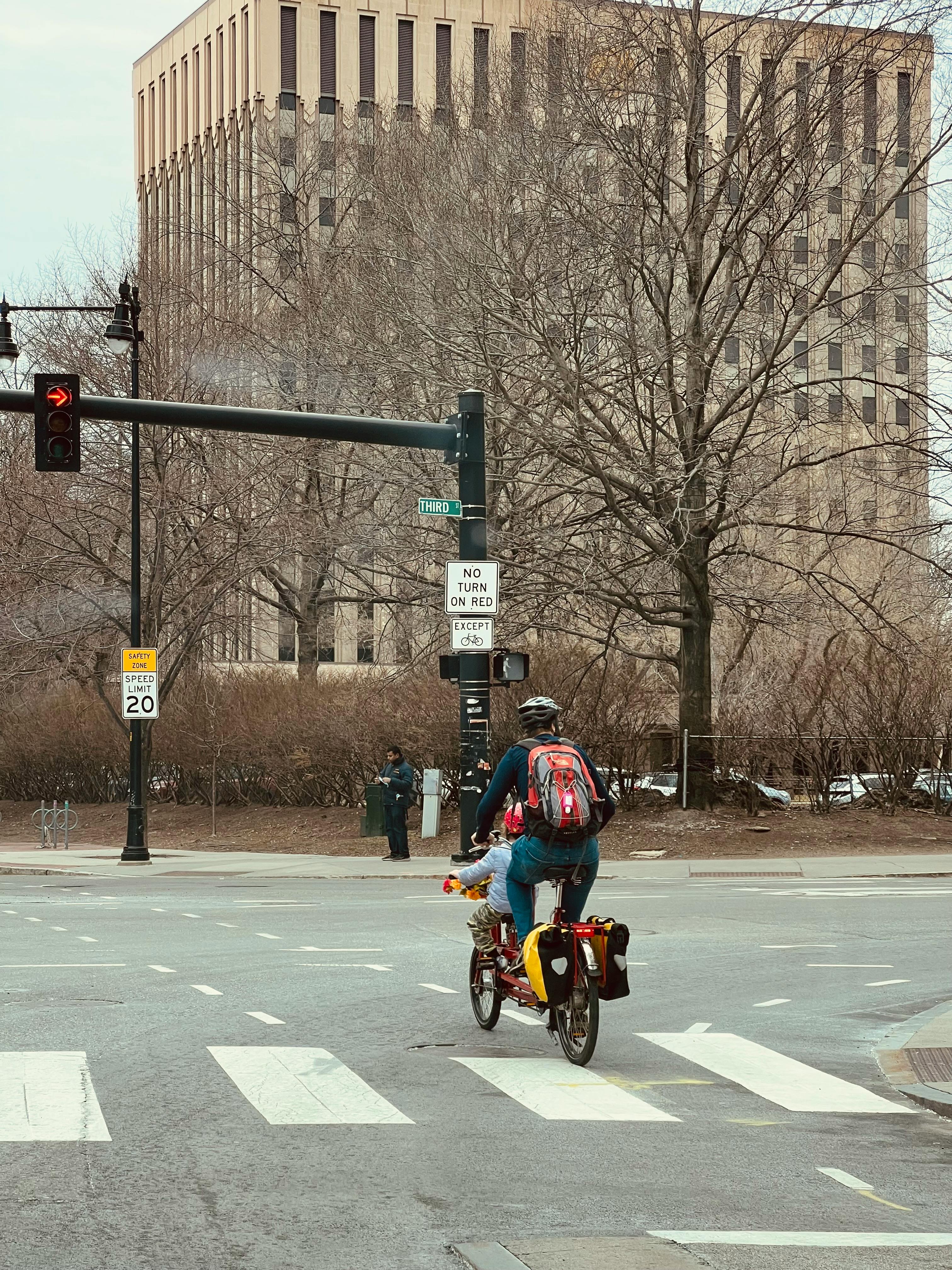 Person Cycling on Street in Town · Free Stock Photo