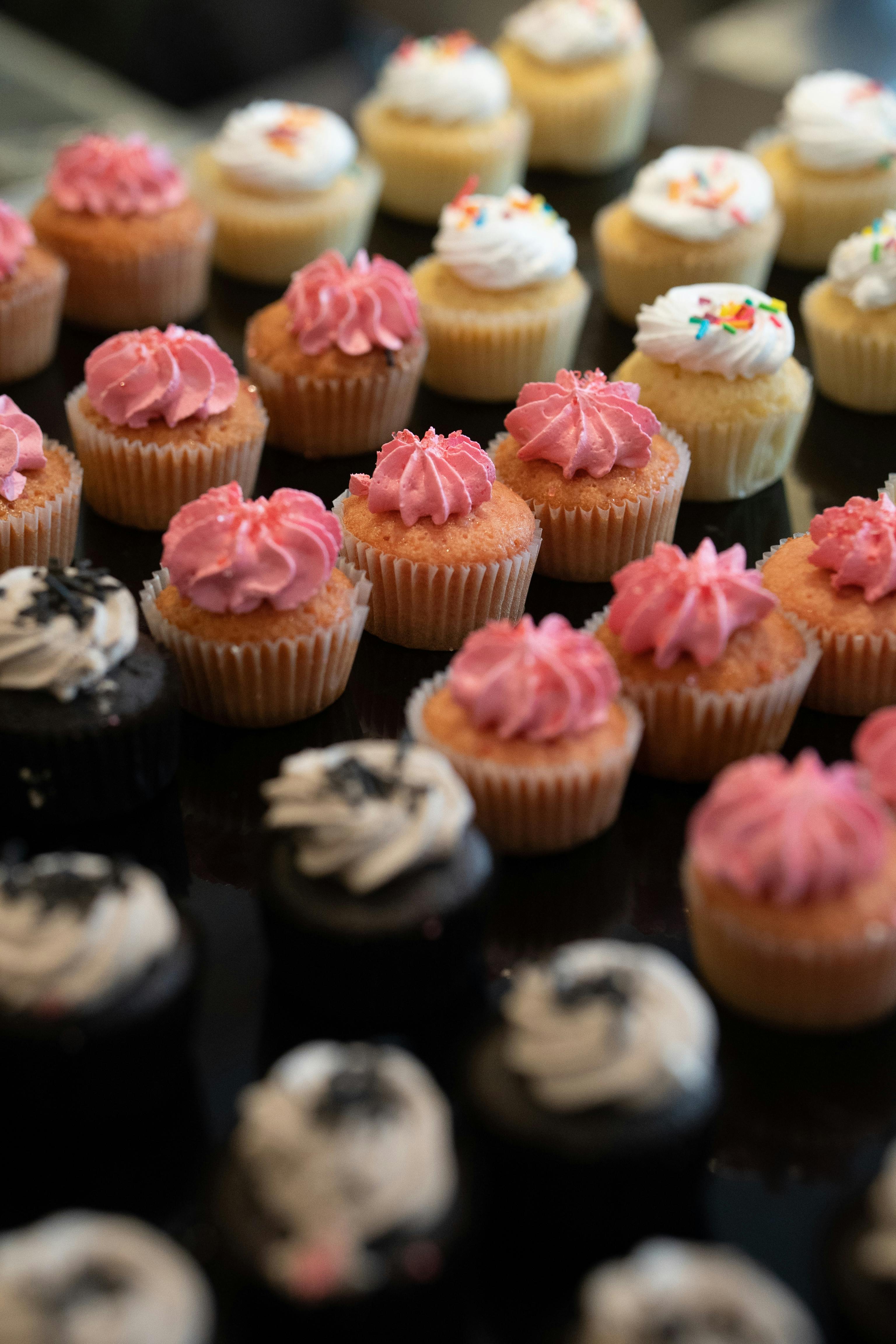 Cupcakes on Parchment Paper and Scattered Nuts · Free Stock Photo
