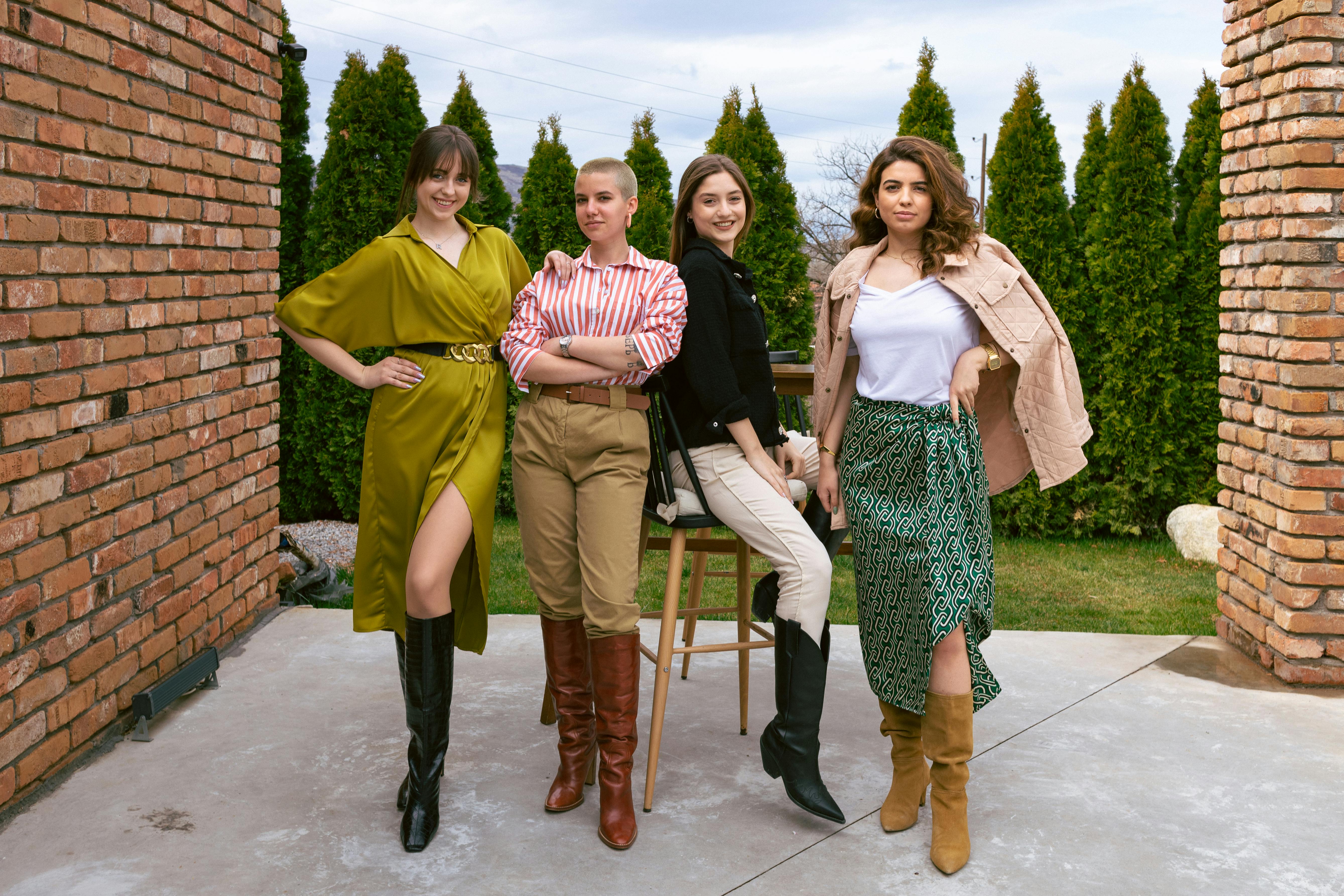 Four Models Posing Together · Free Stock Photo