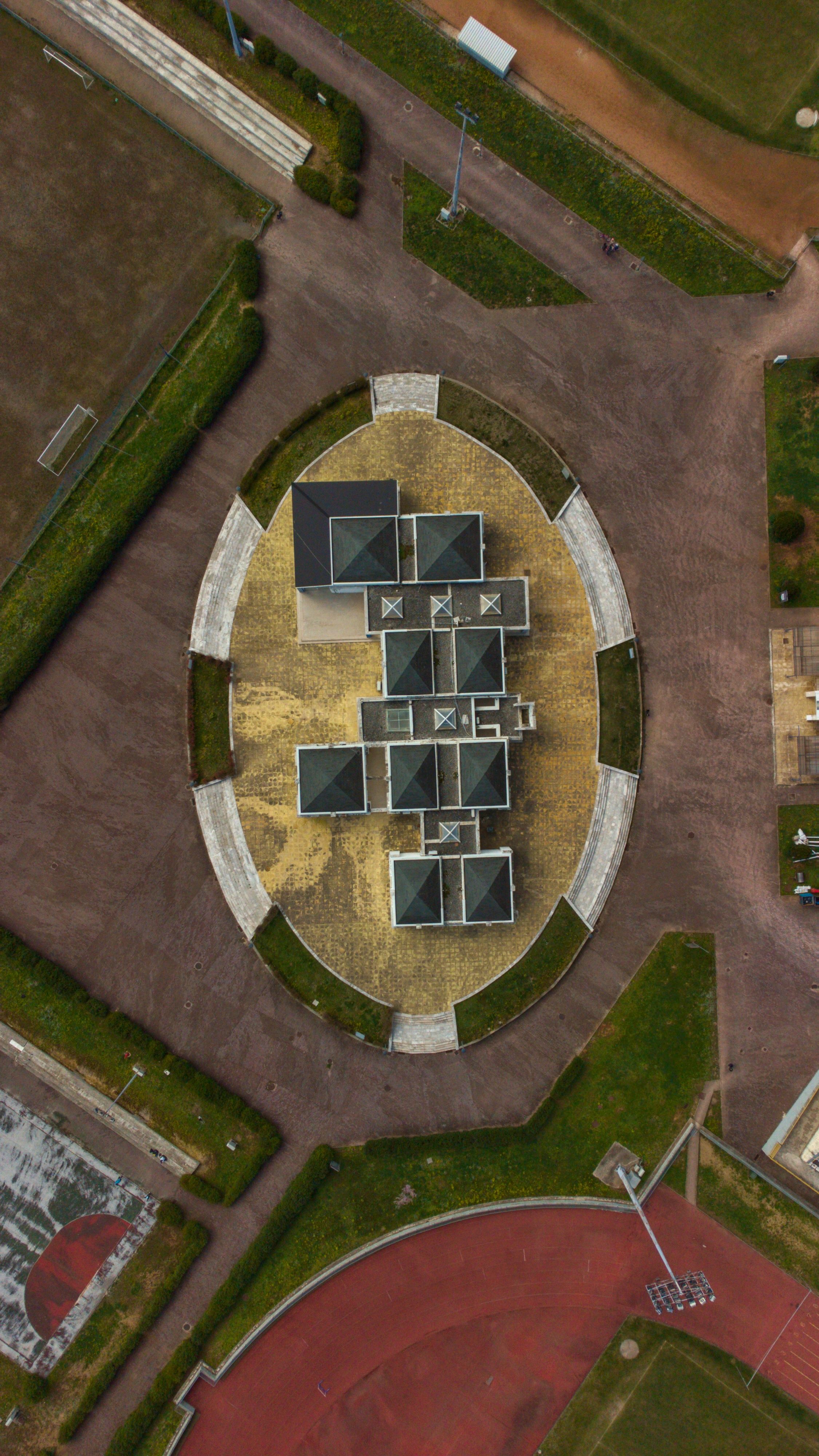 Top View of a Building Complex and a Running Track · Free Stock Photo