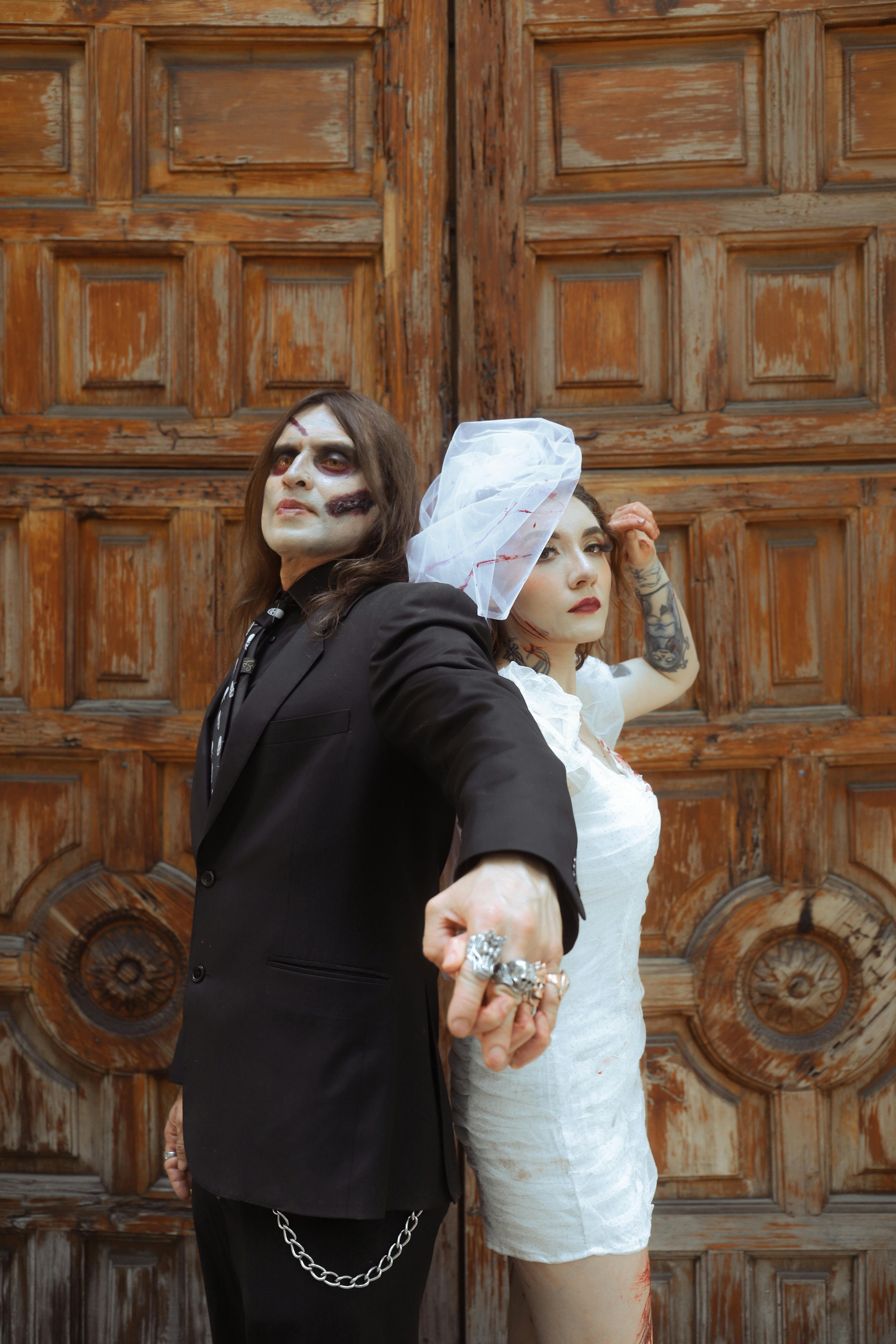 A Couple Dressed as a Bride and a Groom · Free Stock Photo