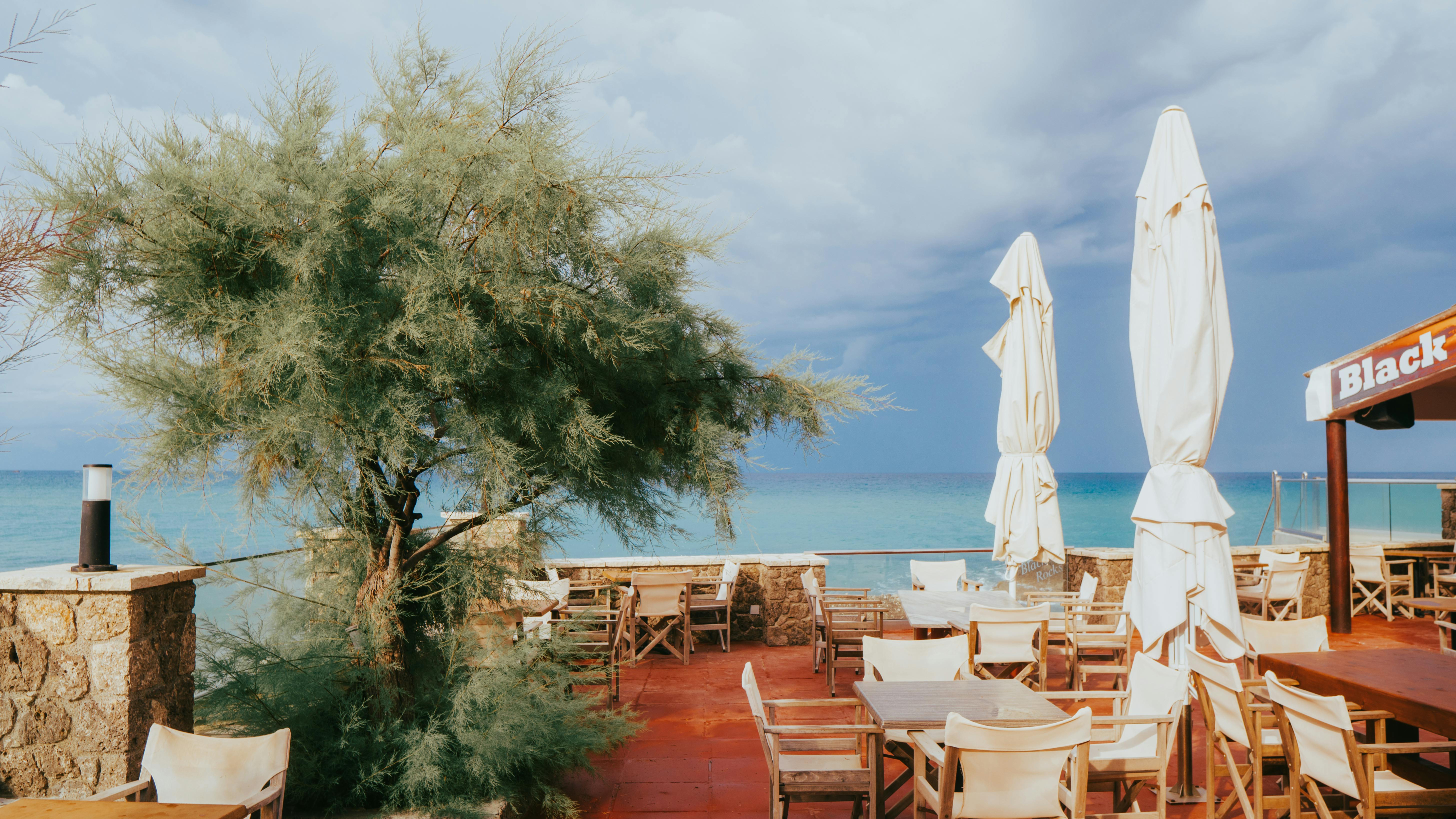 Terrace of summer cafe located on seashore · Free Stock Photo