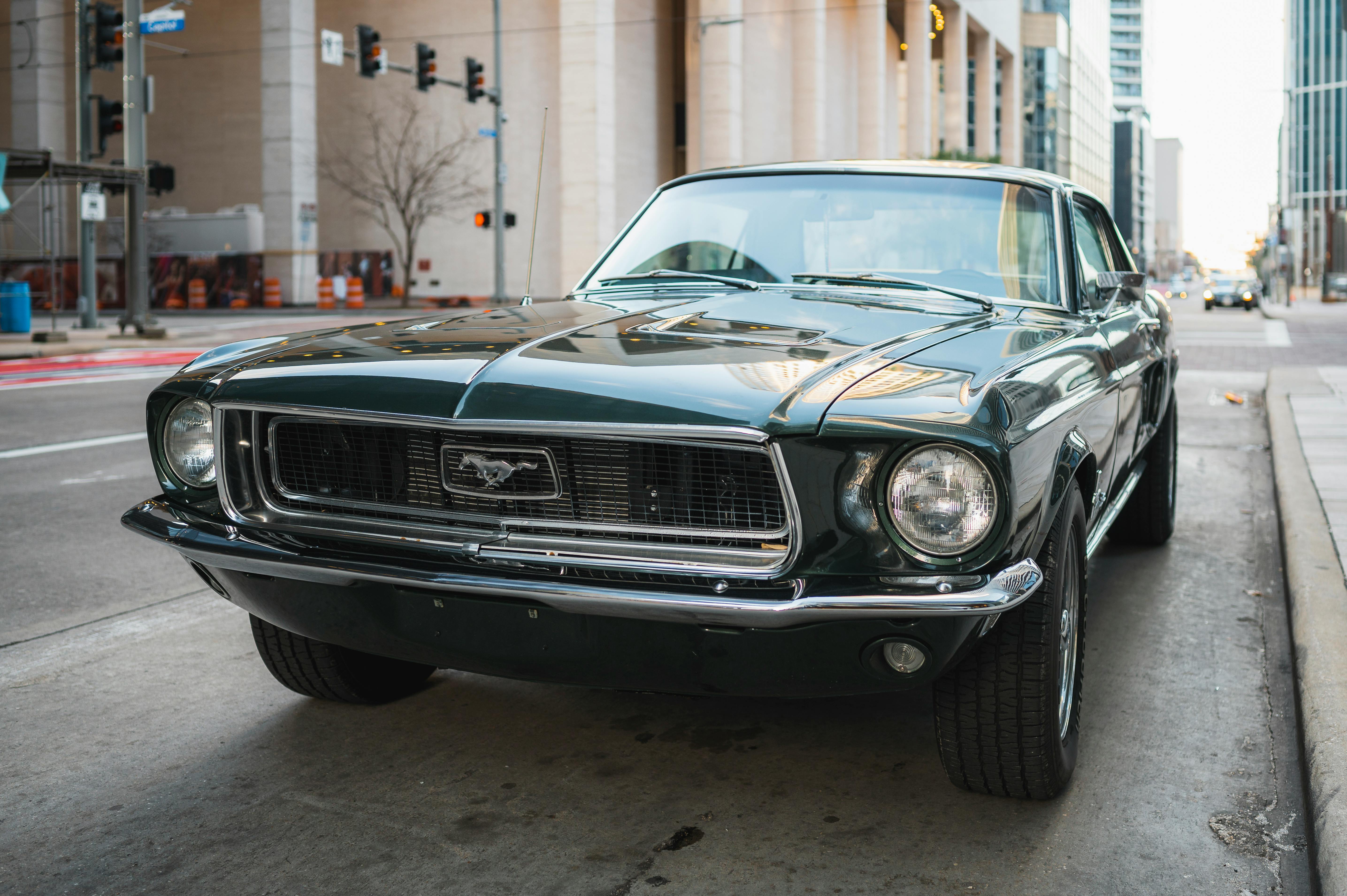 A Green Ford Mustang from the 1960s Parked on a Side of a Street · Free ...