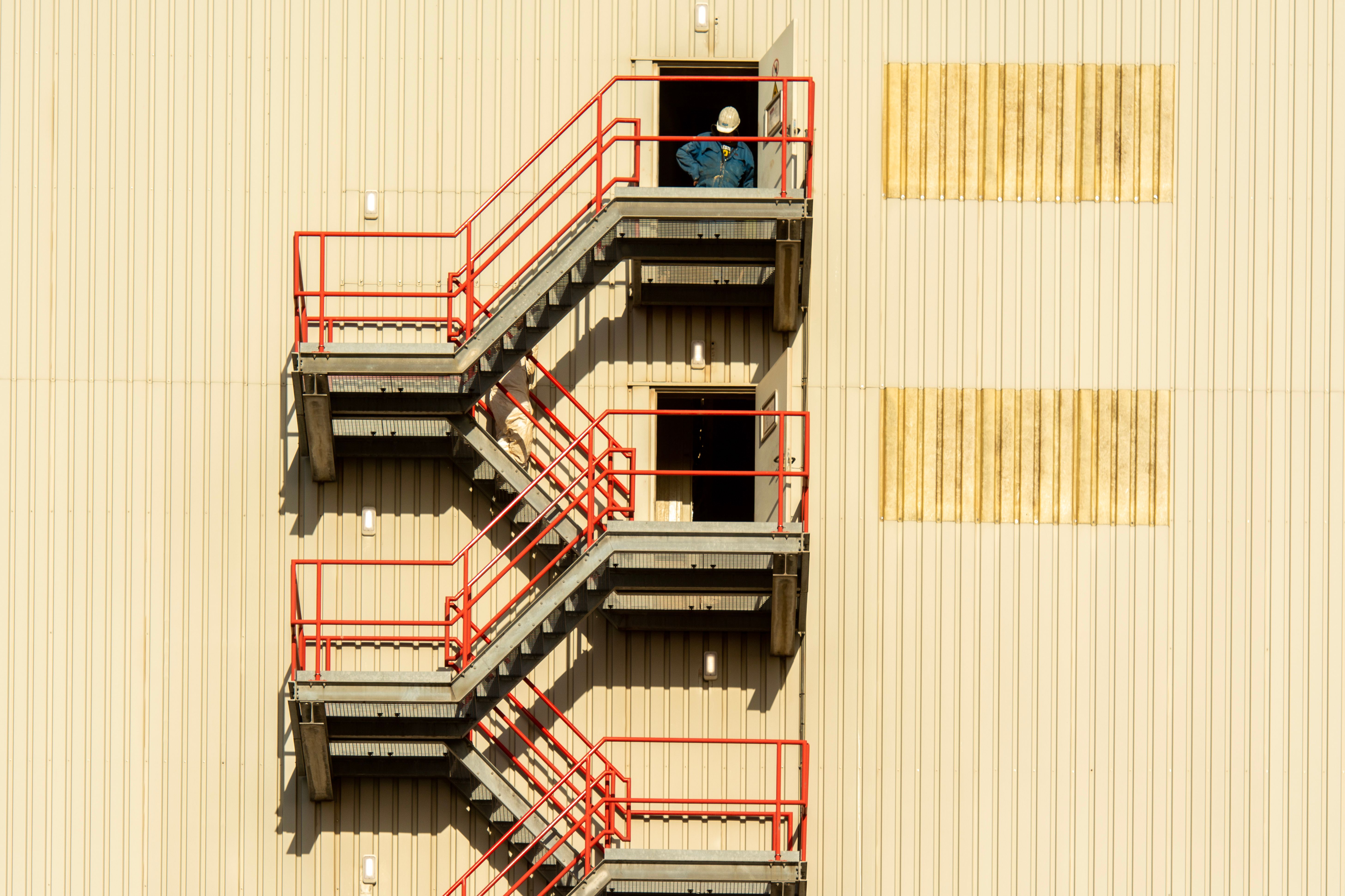 White Building With Fire Escape Stairs · Free Stock Photo