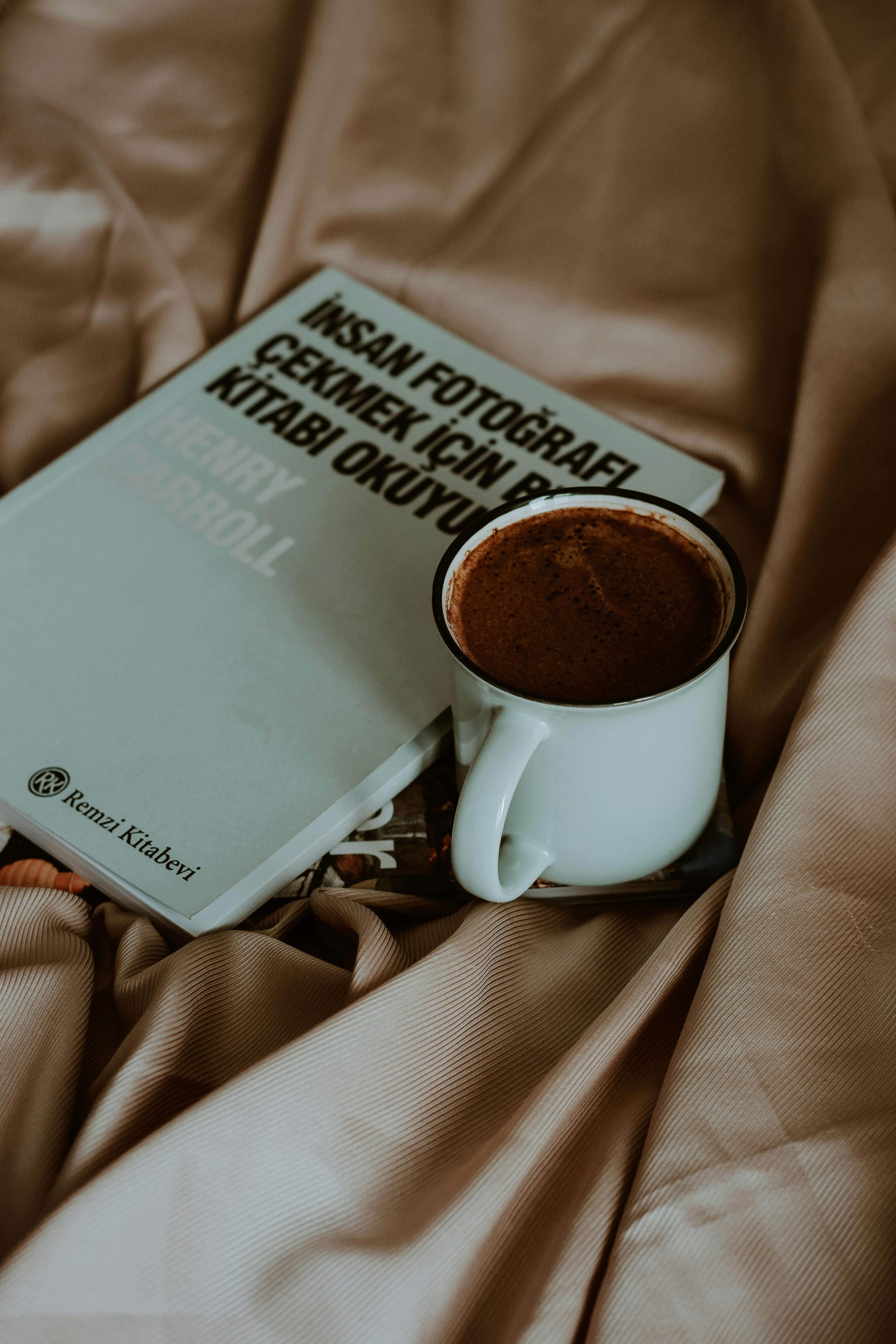 An Open Book Beside the Laptop · Free Stock Photo