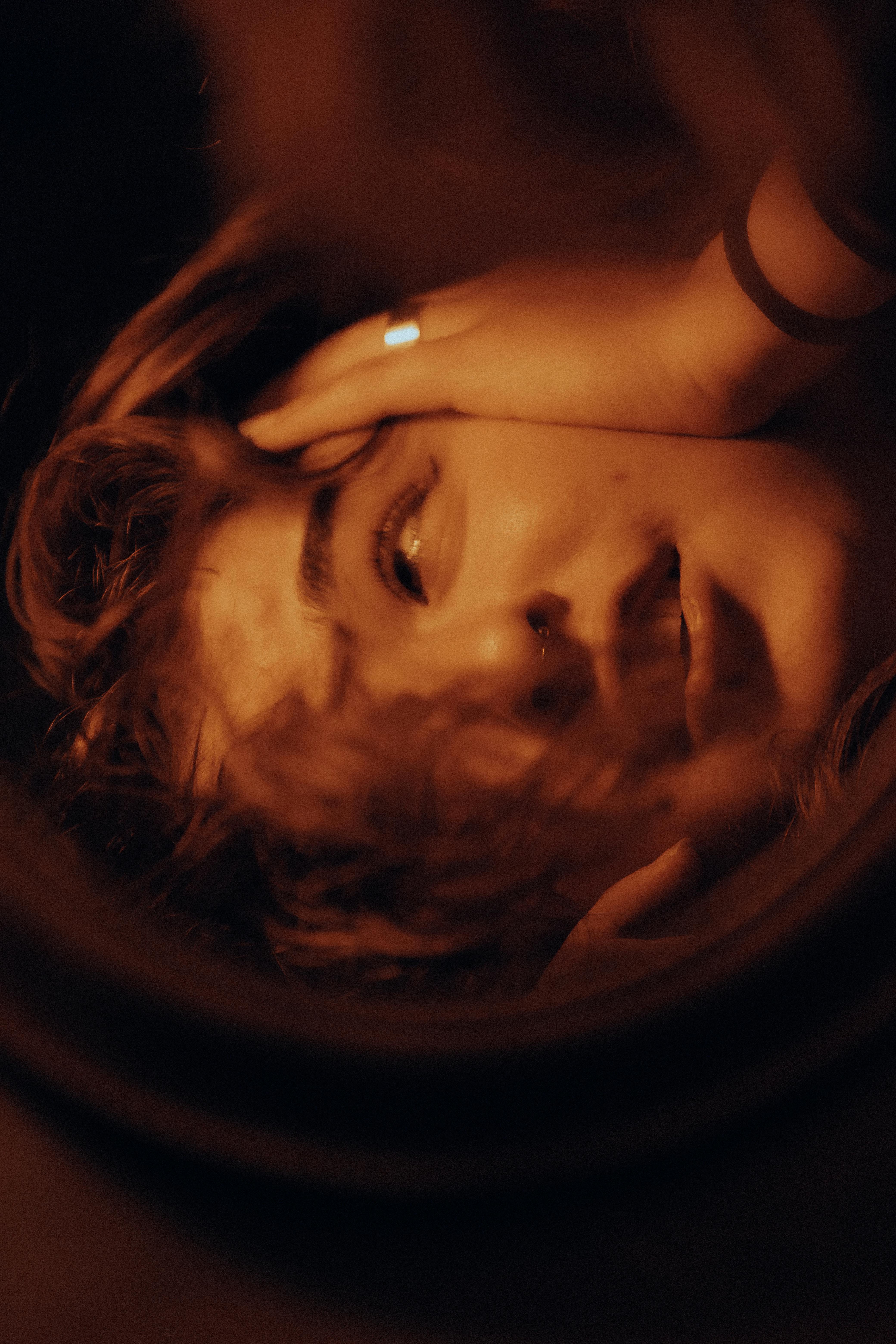 Blurry Mirror Reflection of a Young Woman · Free Stock Photo