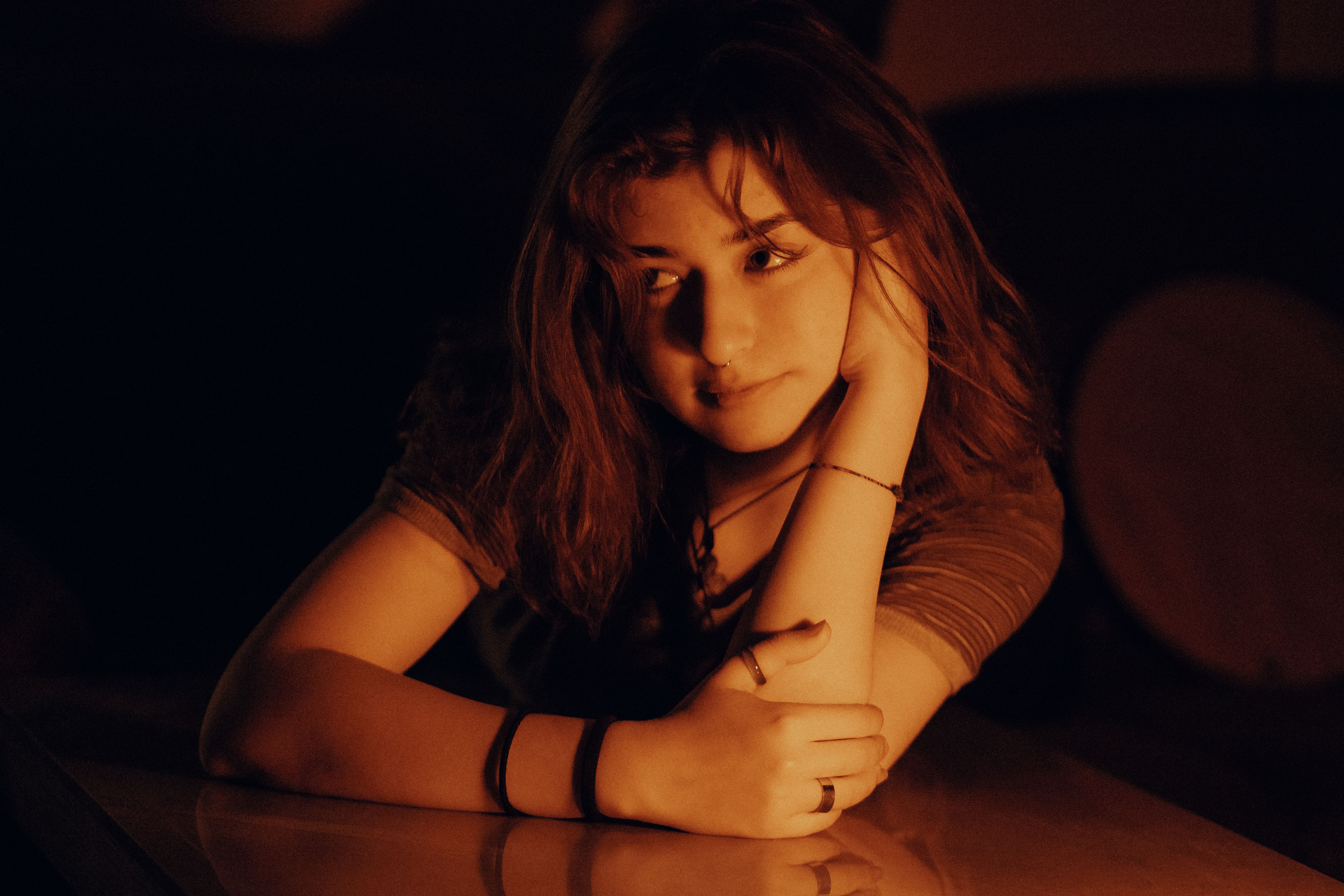 Photo of a Woman Leaning on her Hand · Free Stock Photo