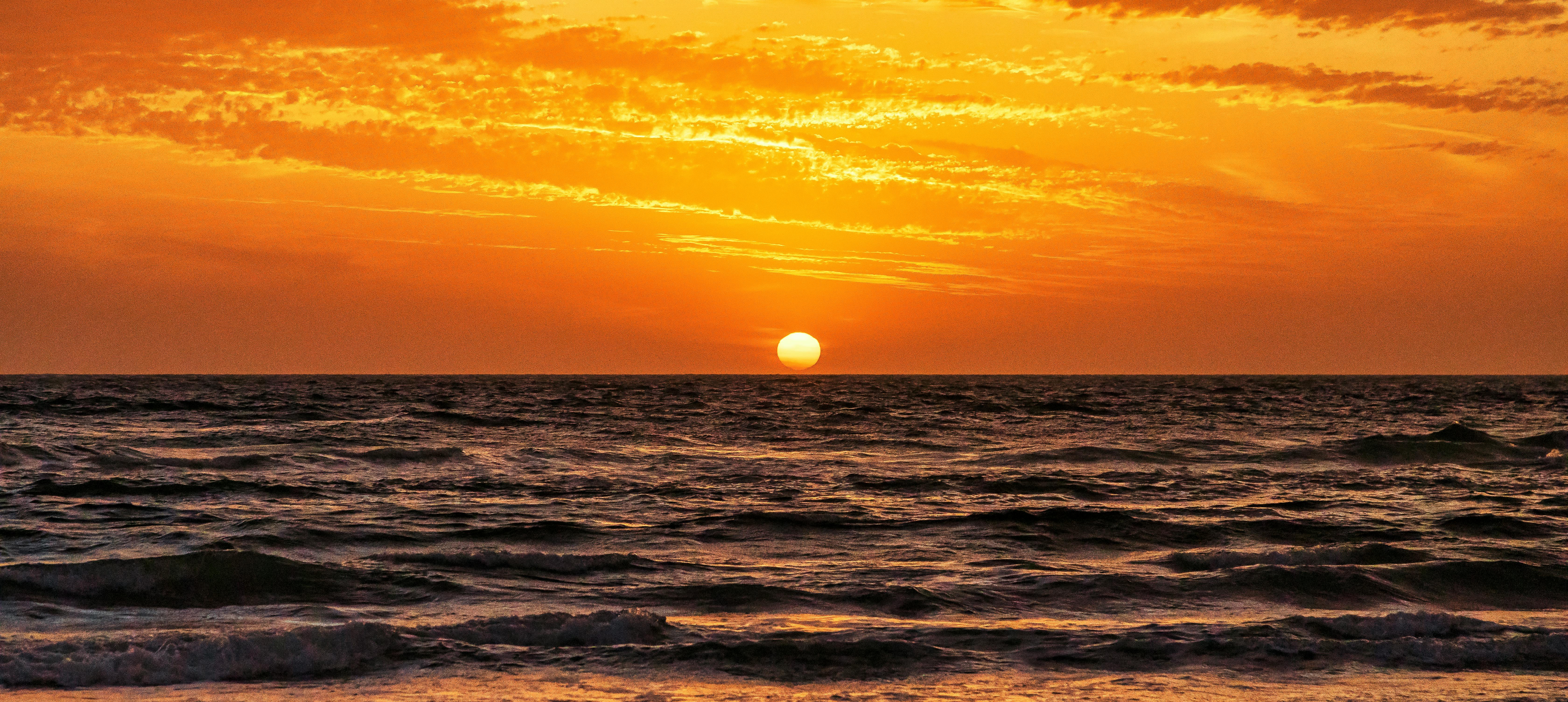 Sun Setting on Sea Horizon · Free Stock Photo
