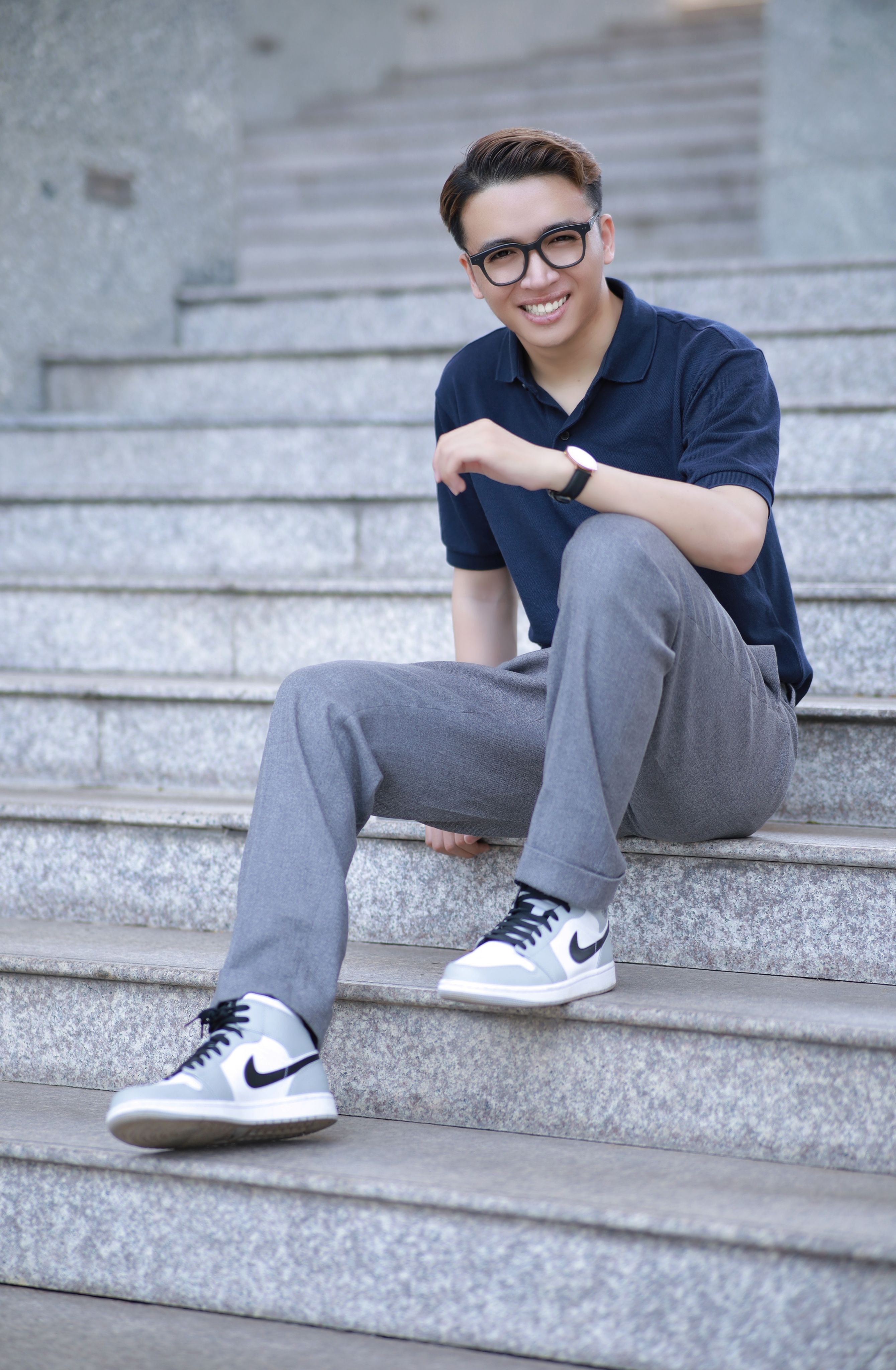 Man Sitting on Steps and Smiling · Free Stock Photo