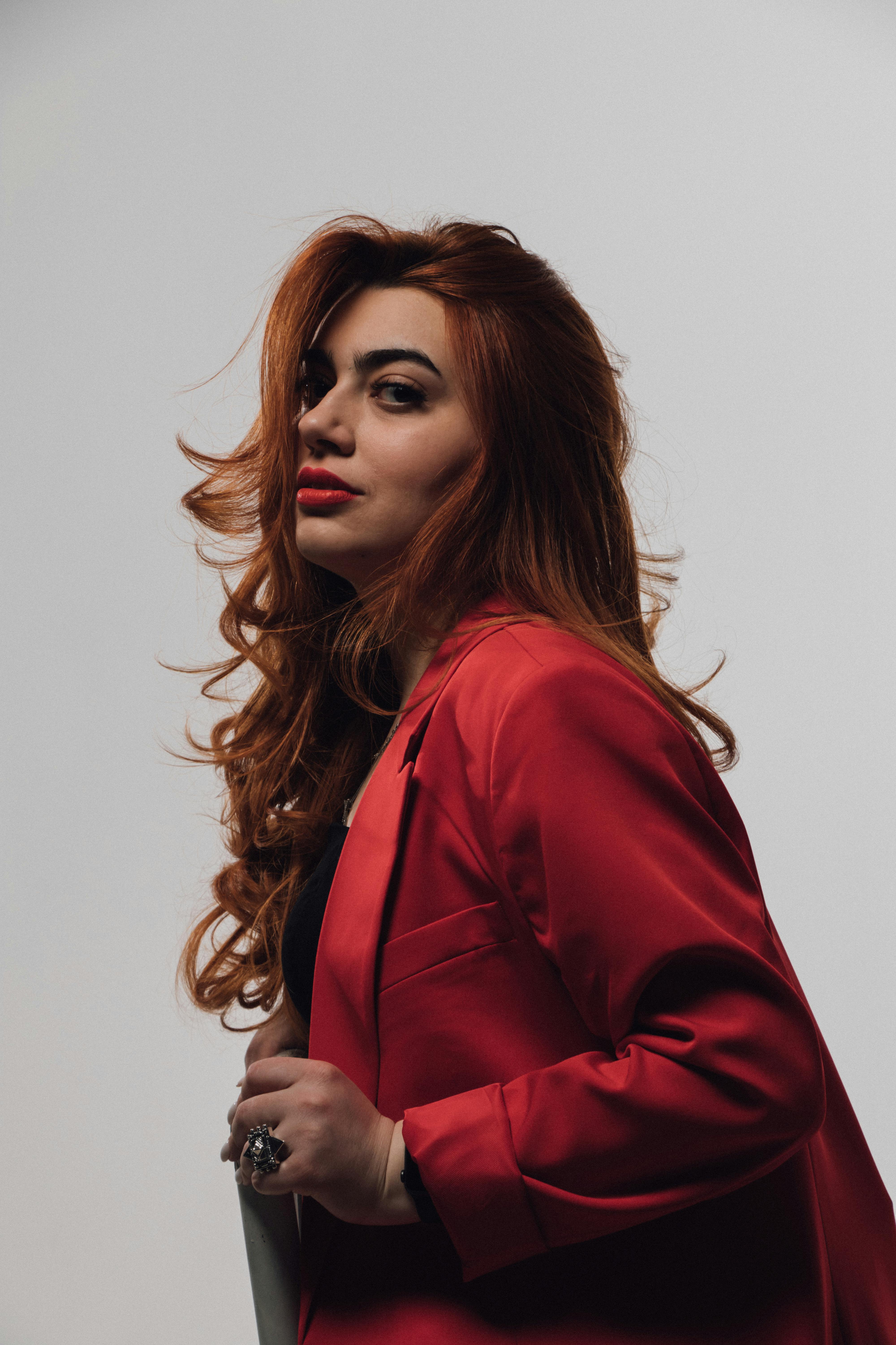 Red Haired Woman in a Red Coat · Free Stock Photo