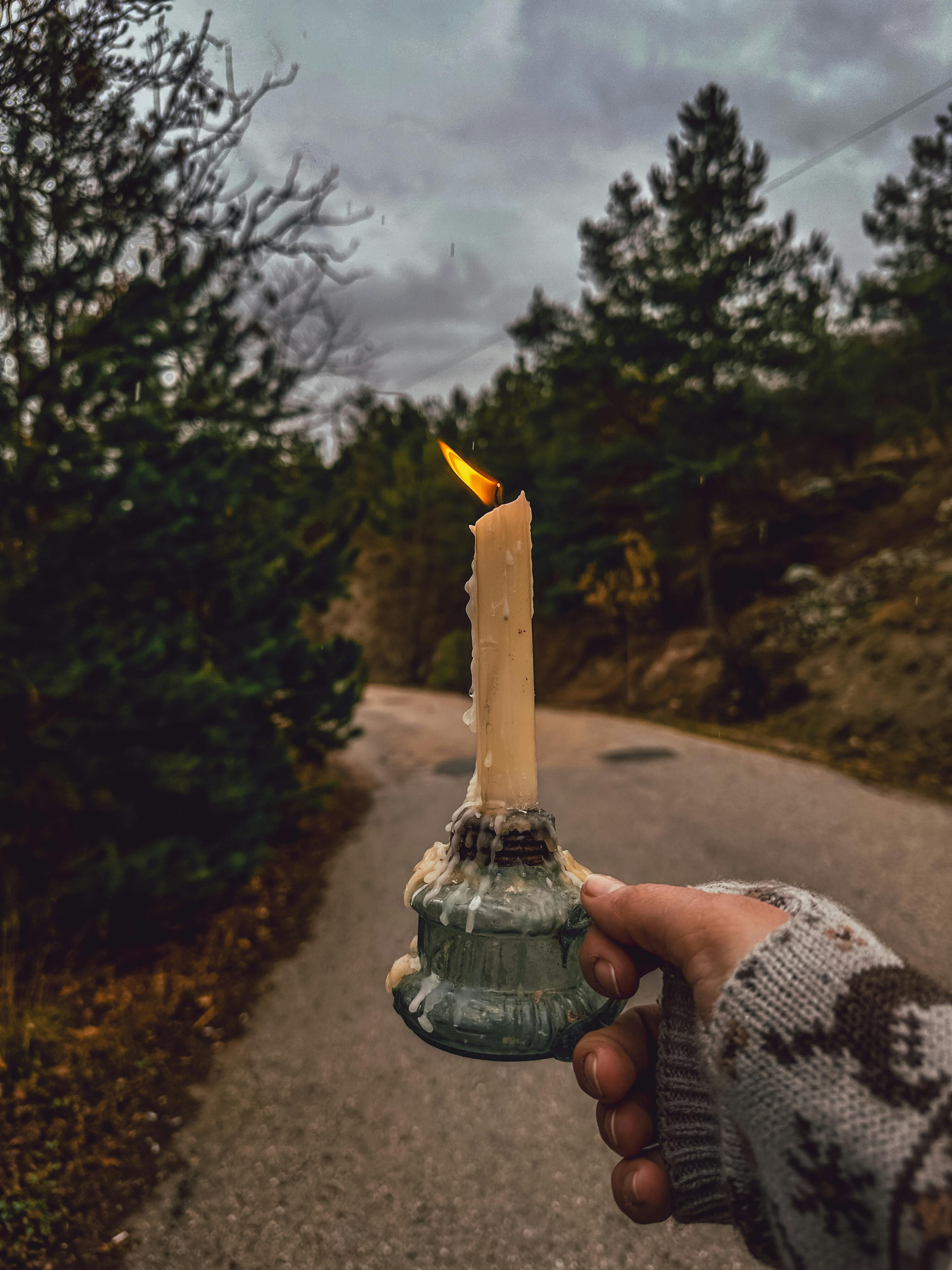 Photo of Person Holding Scented Candle · Free Stock Photo