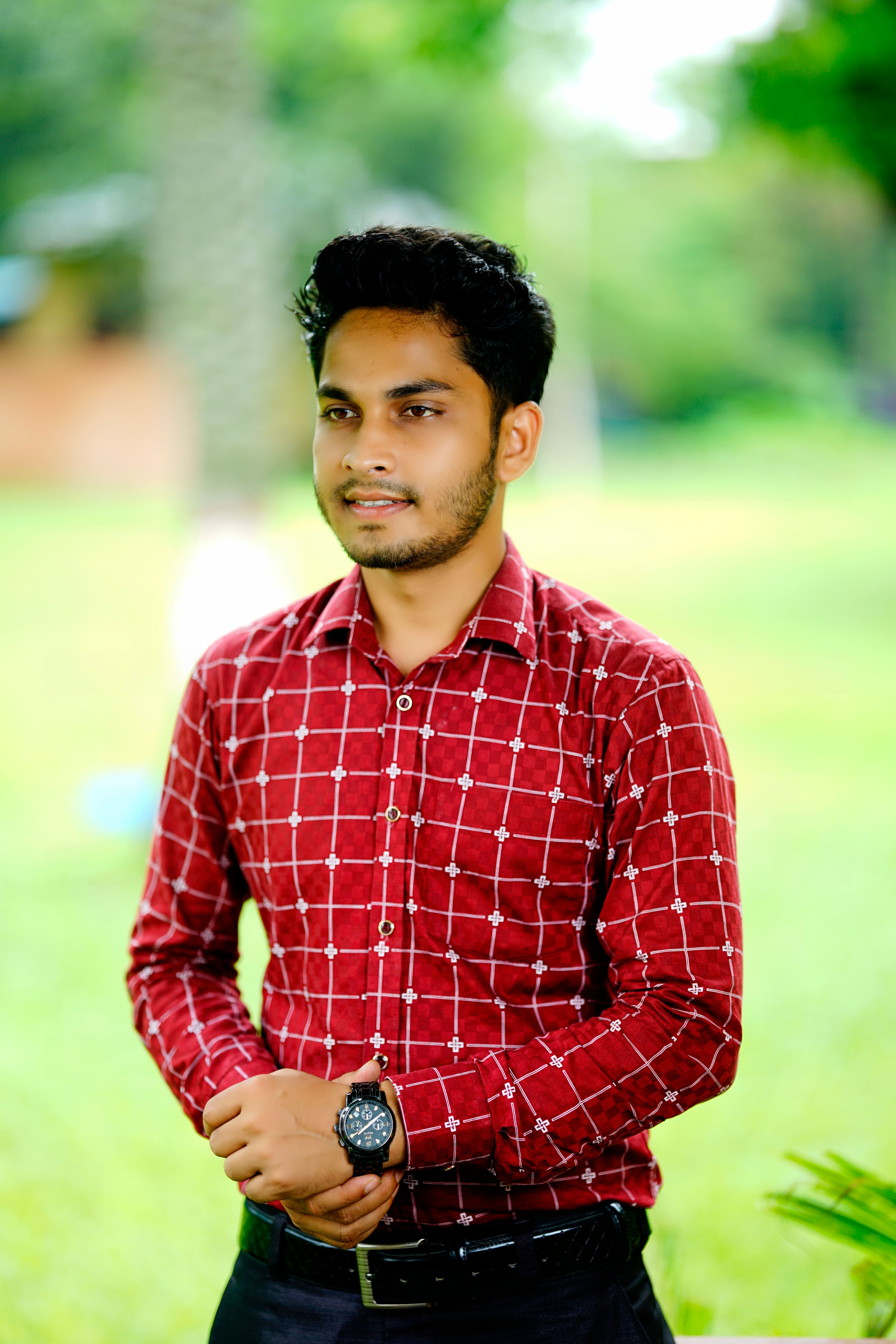 Man Wearing a Checked Shirt in a Park · Free Stock Photo