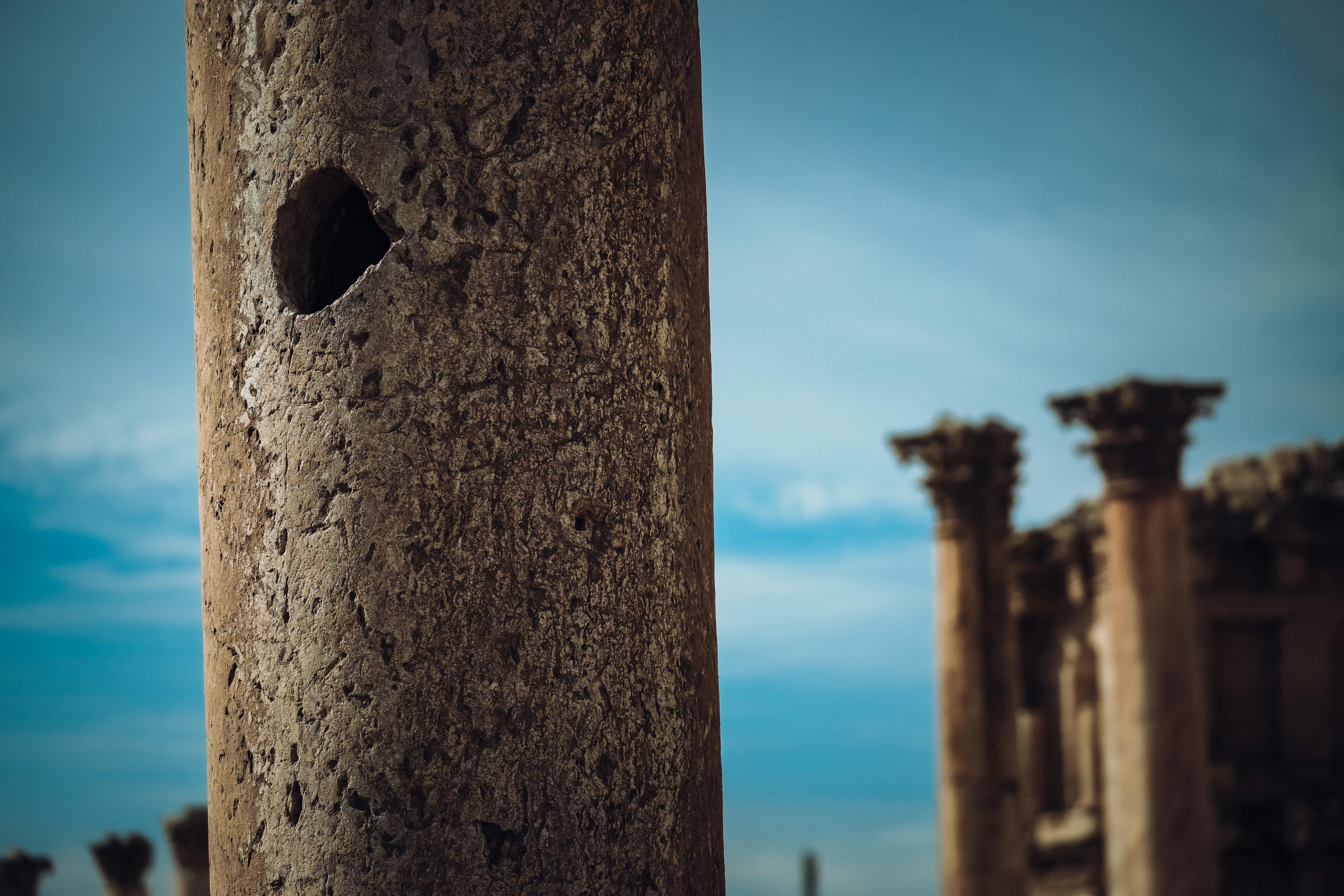 Person Walking Near Columns · Free Stock Photo
