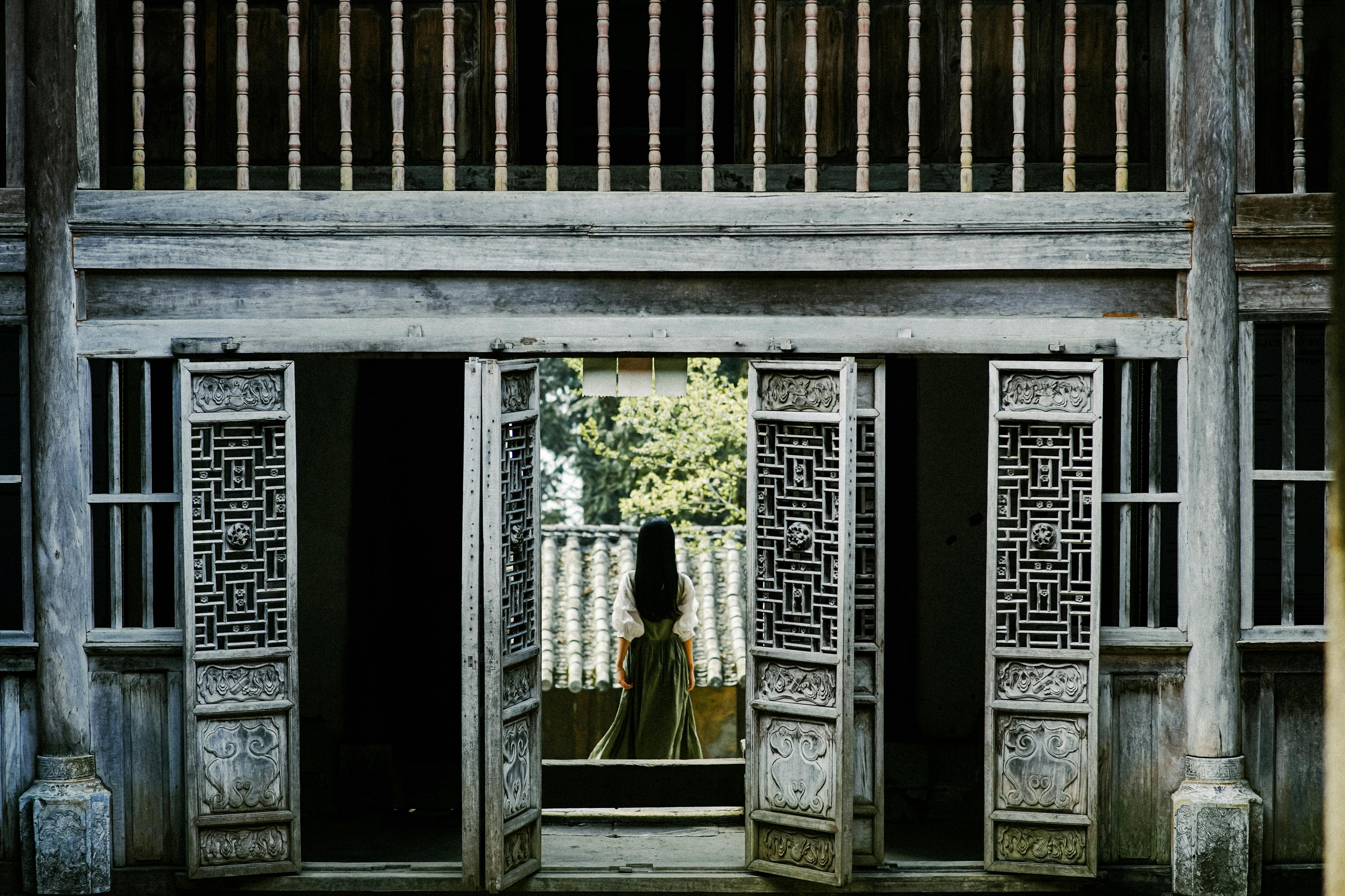 Woman in dress Standing behind Door · Free Stock Photo