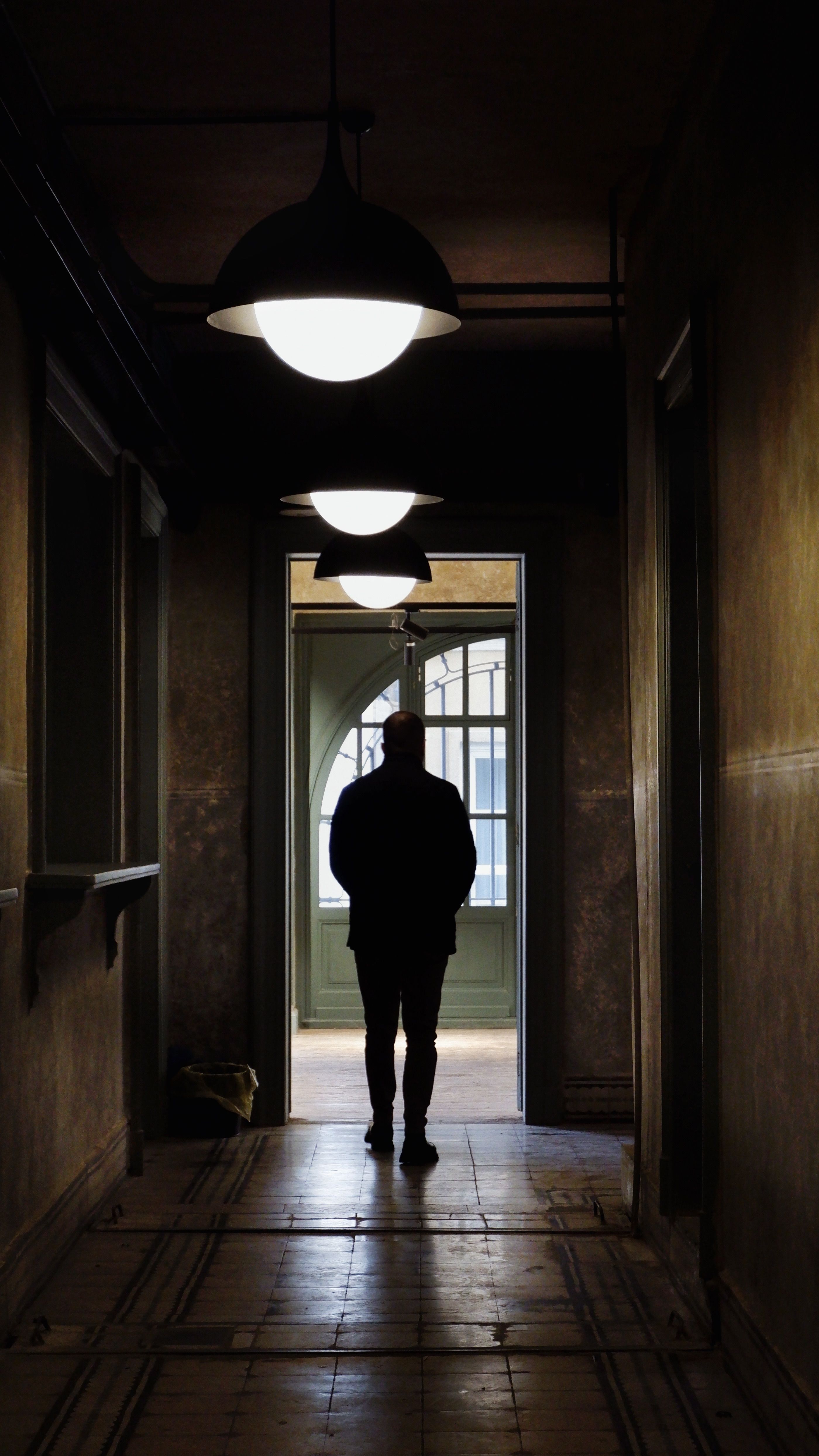 Man Walking on a Hallway · Free Stock Photo