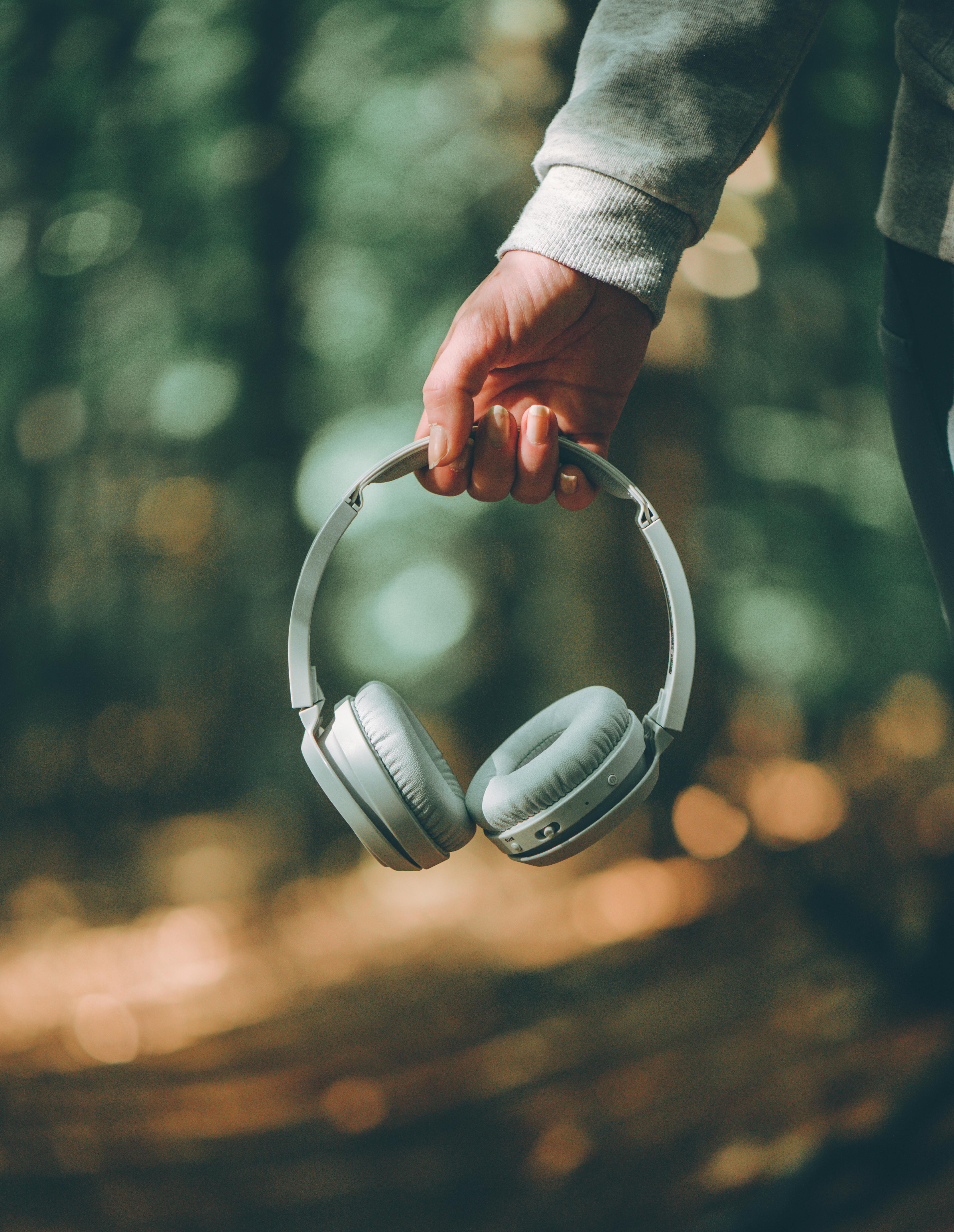 Hand Holding Headphones · Free Stock Photo