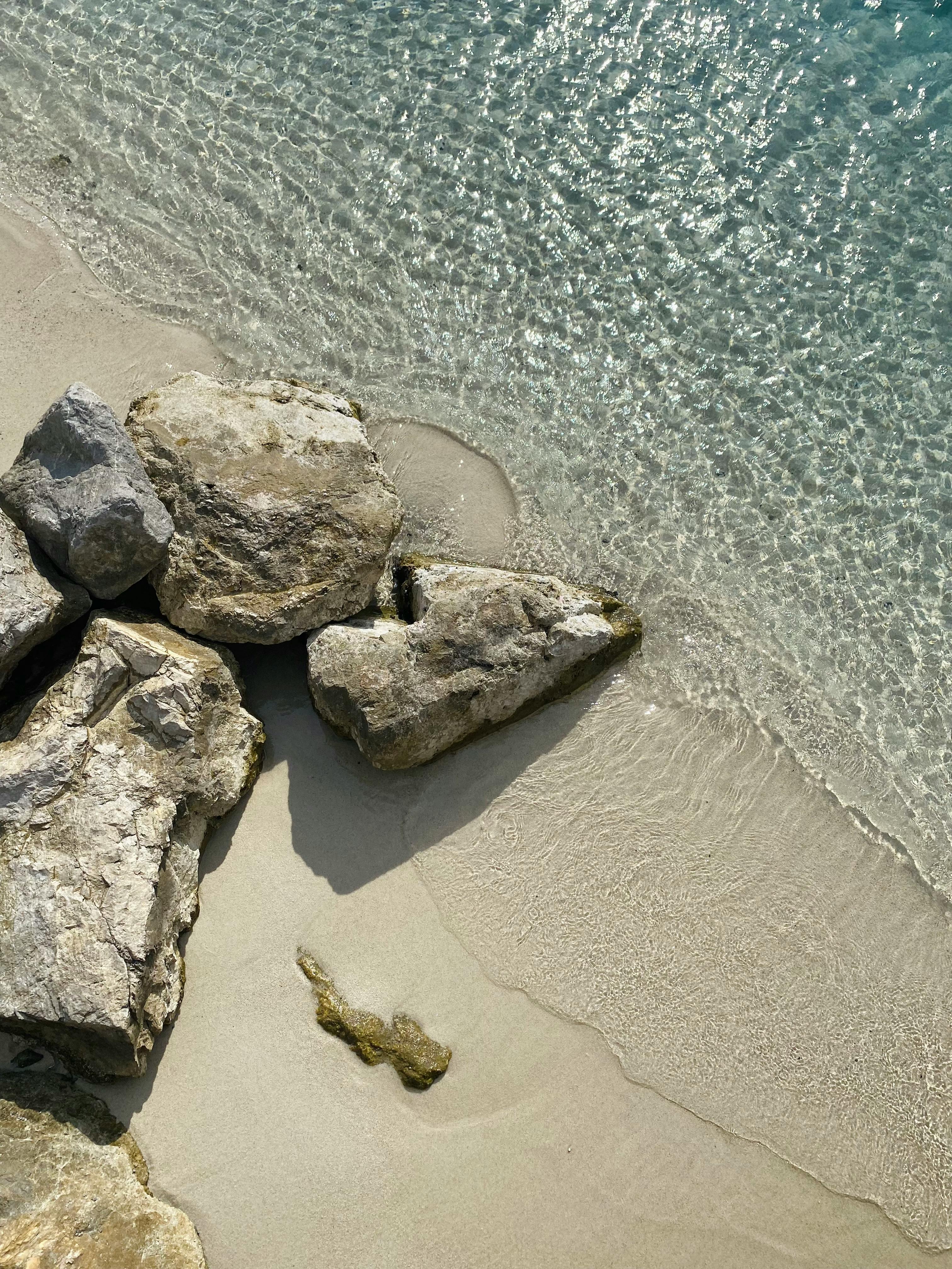 Rocks on Sandy Beach · Free Stock Photo