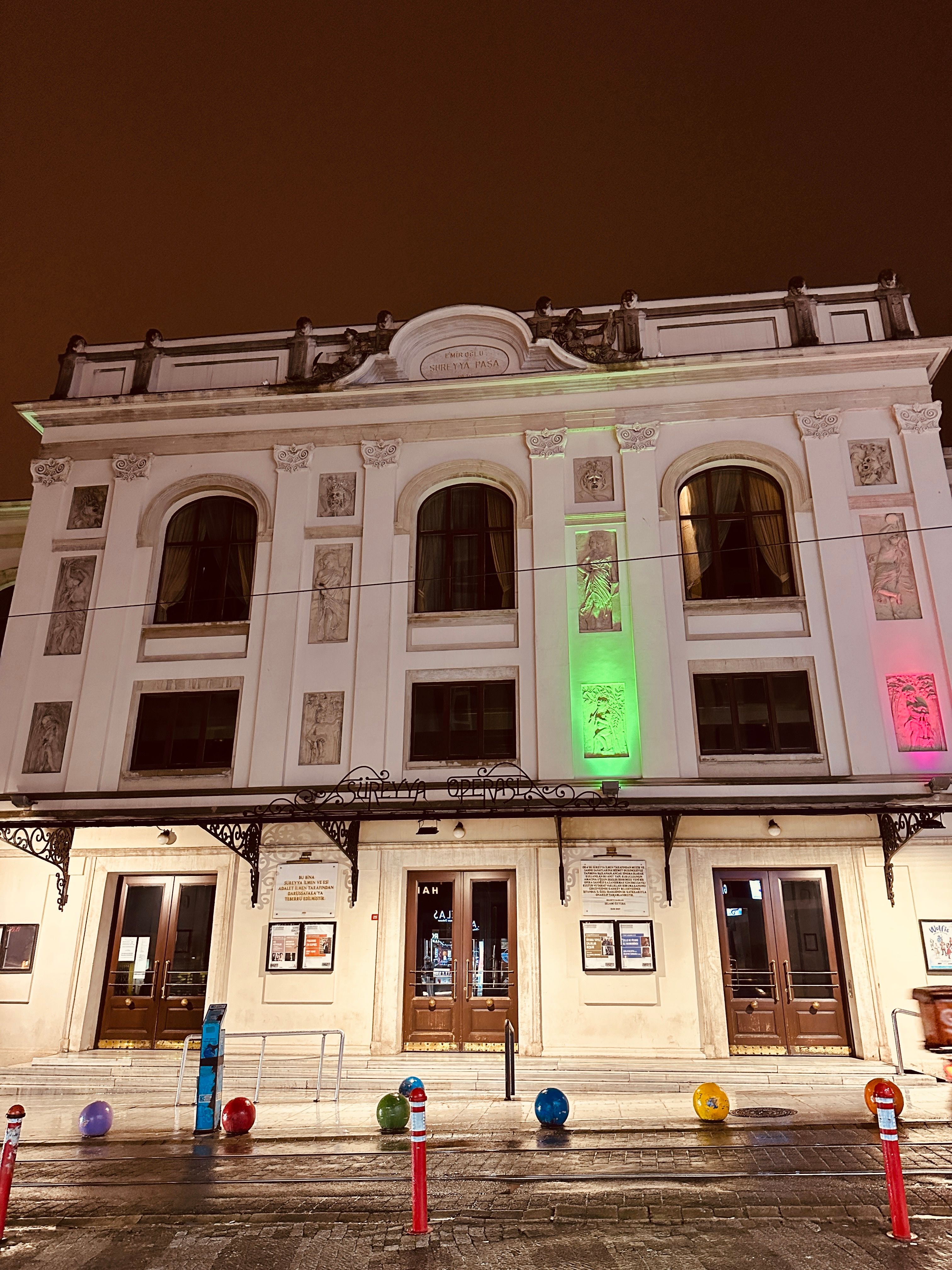 An Illuminated Building by a River · Free Stock Photo