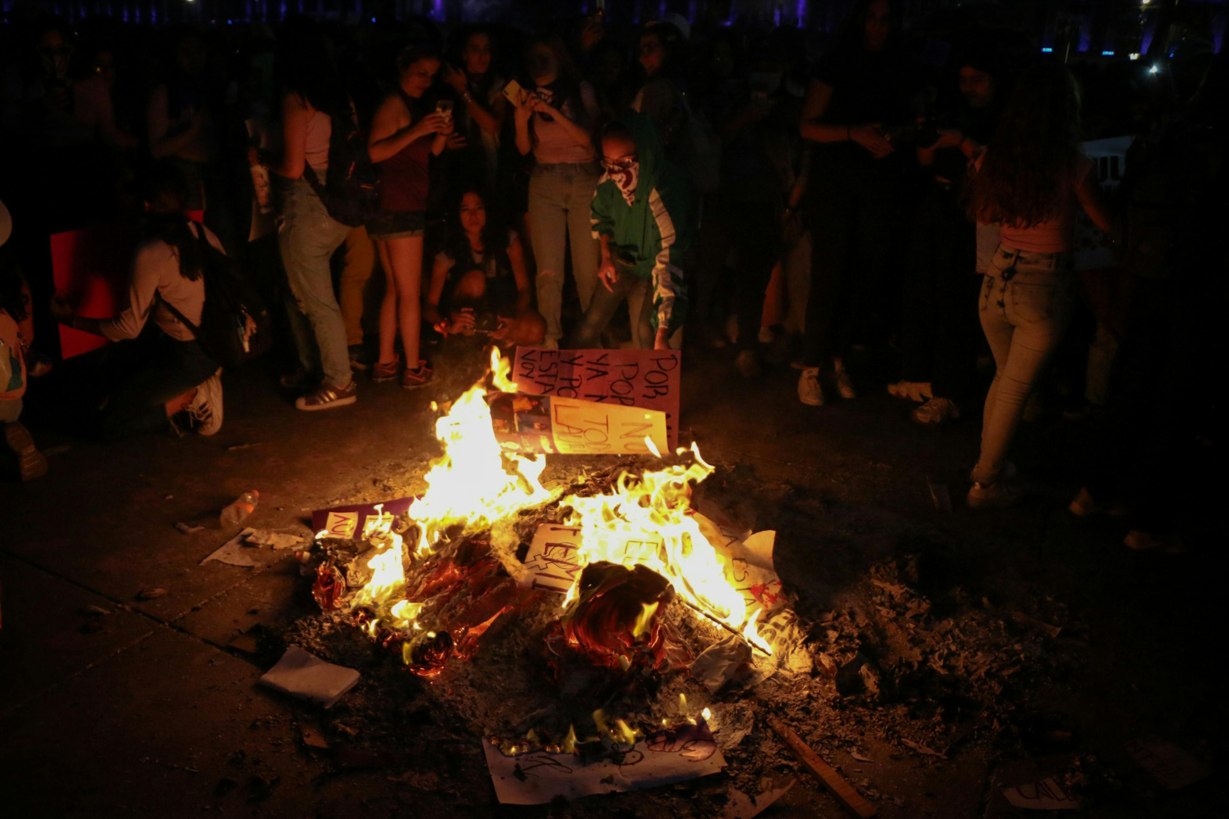 Women Burning Protest Signs in a Bonfire · Free Stock Photo