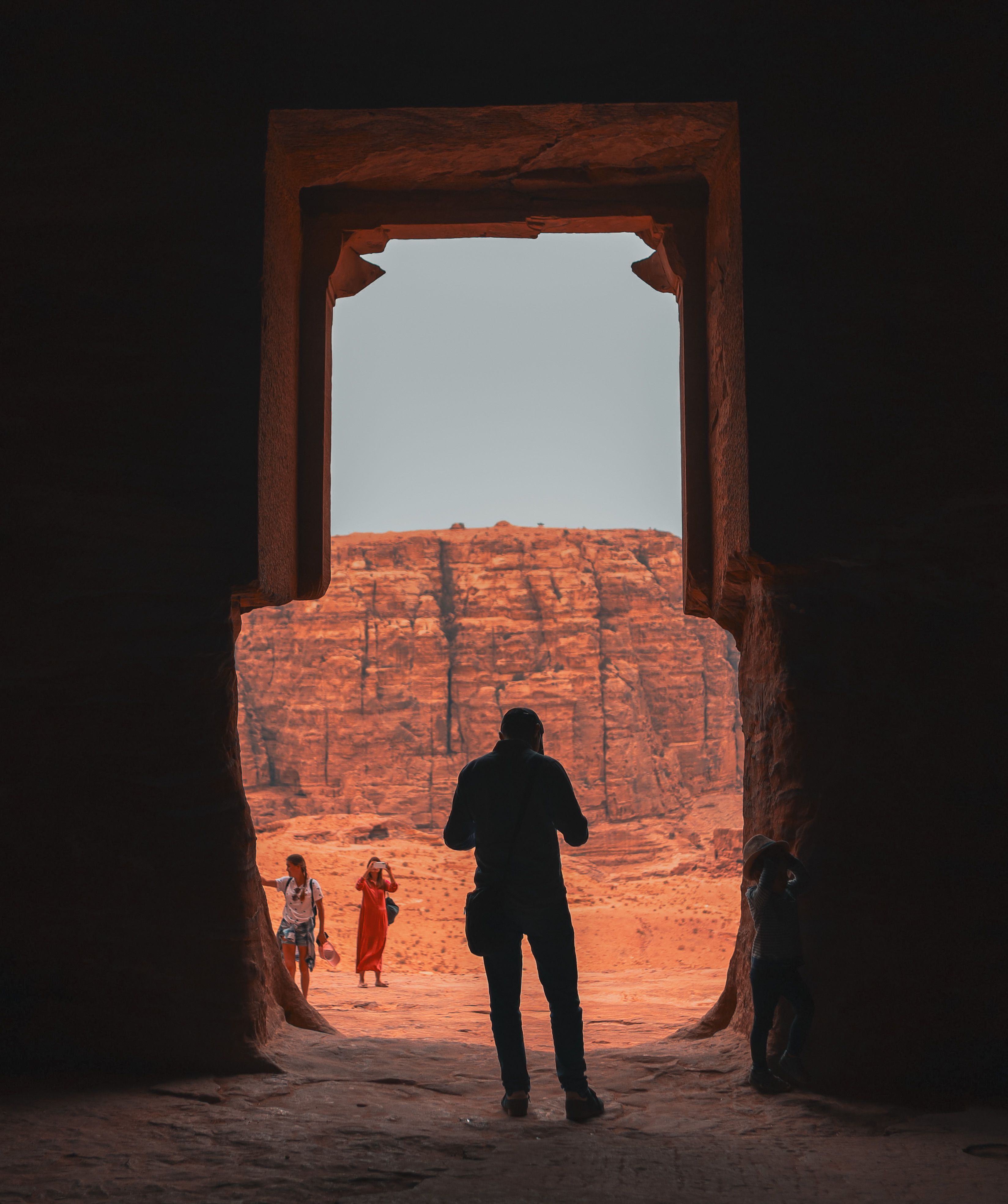 Person Standing in Gate with Canyon Rock behind · Free Stock Photo
