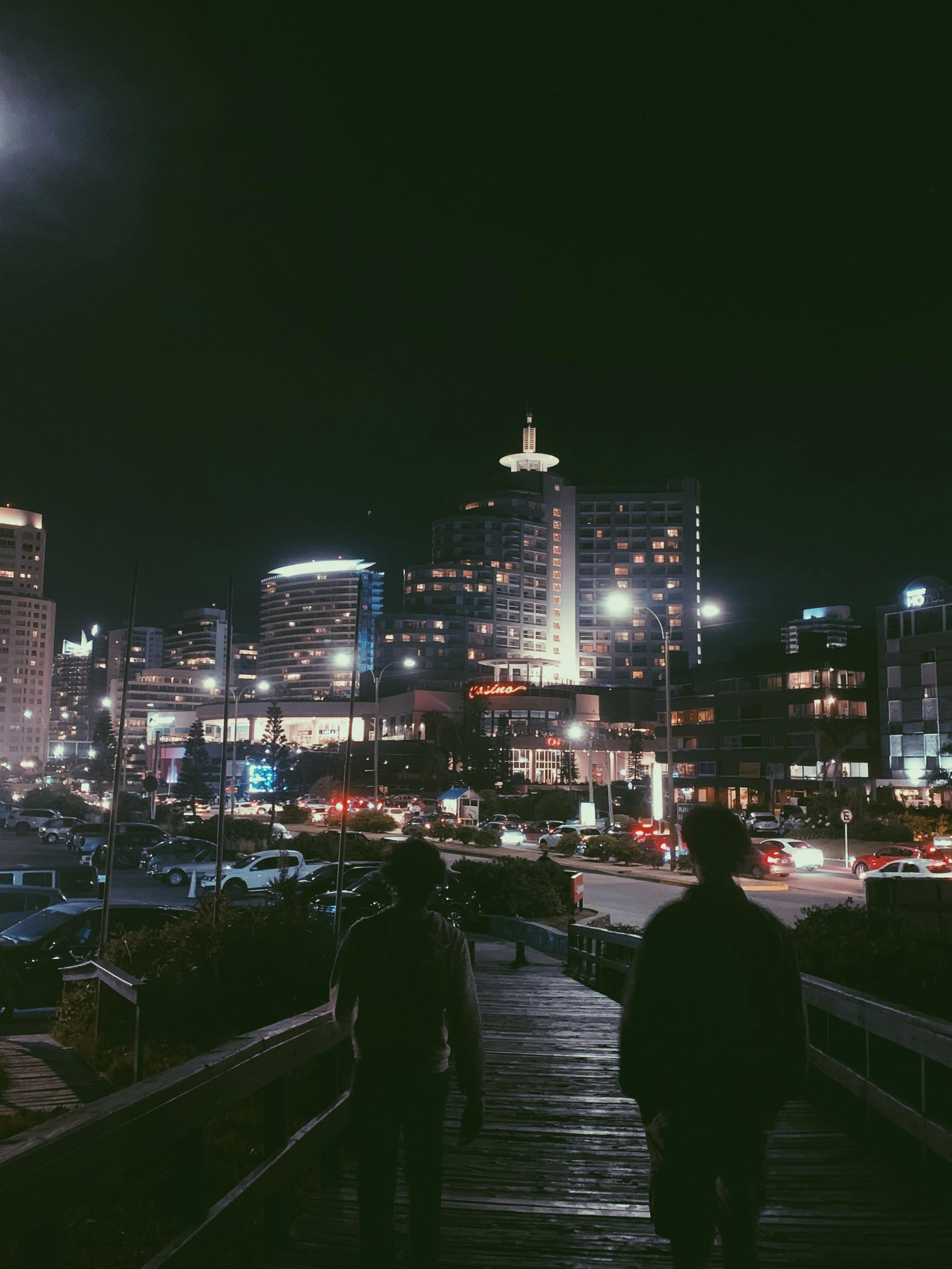 People Walking in Illuminated City at Night · Free Stock Photo