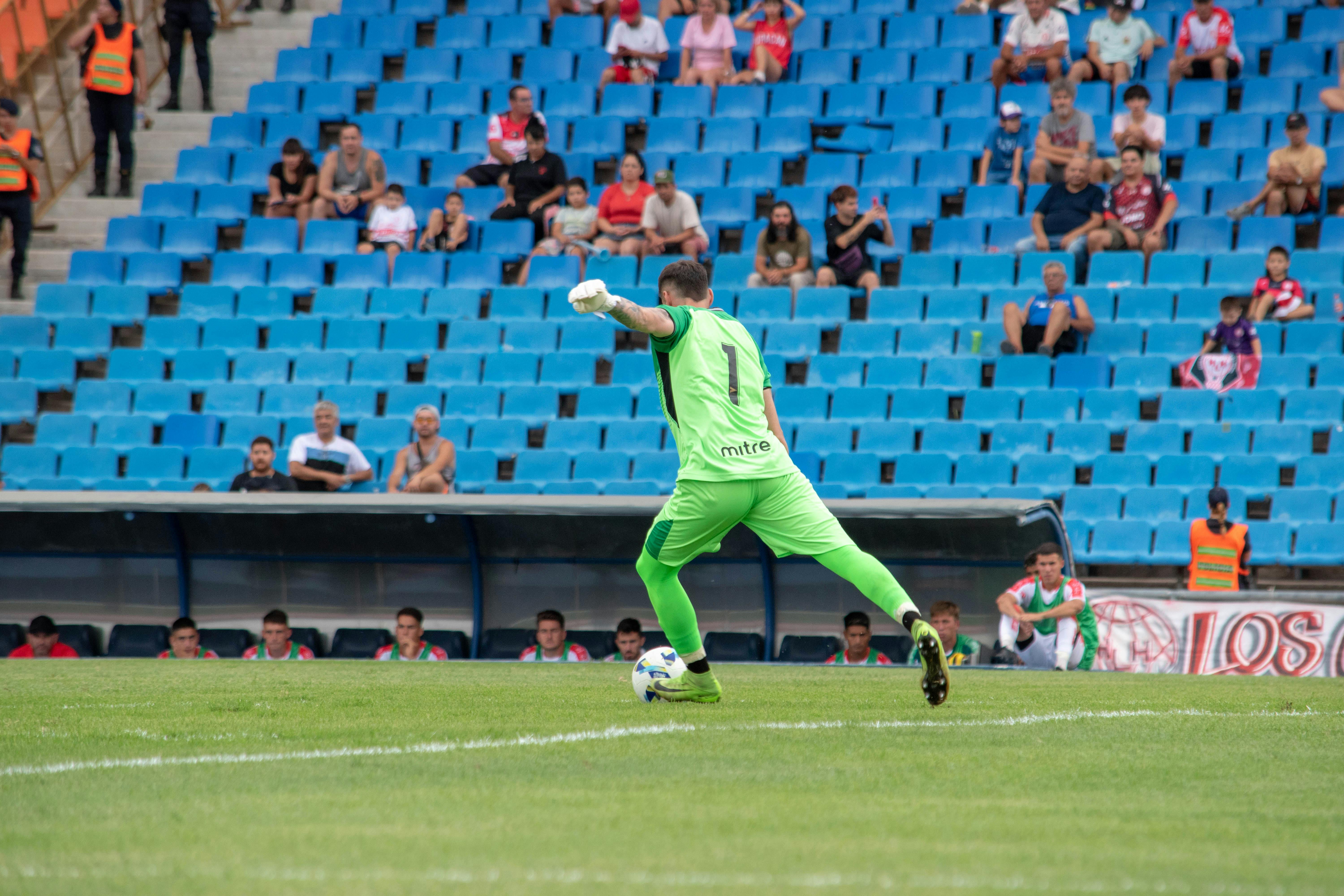 A Goalkeeper Kicking the Ball during a Soccer Match · Free Stock Photo