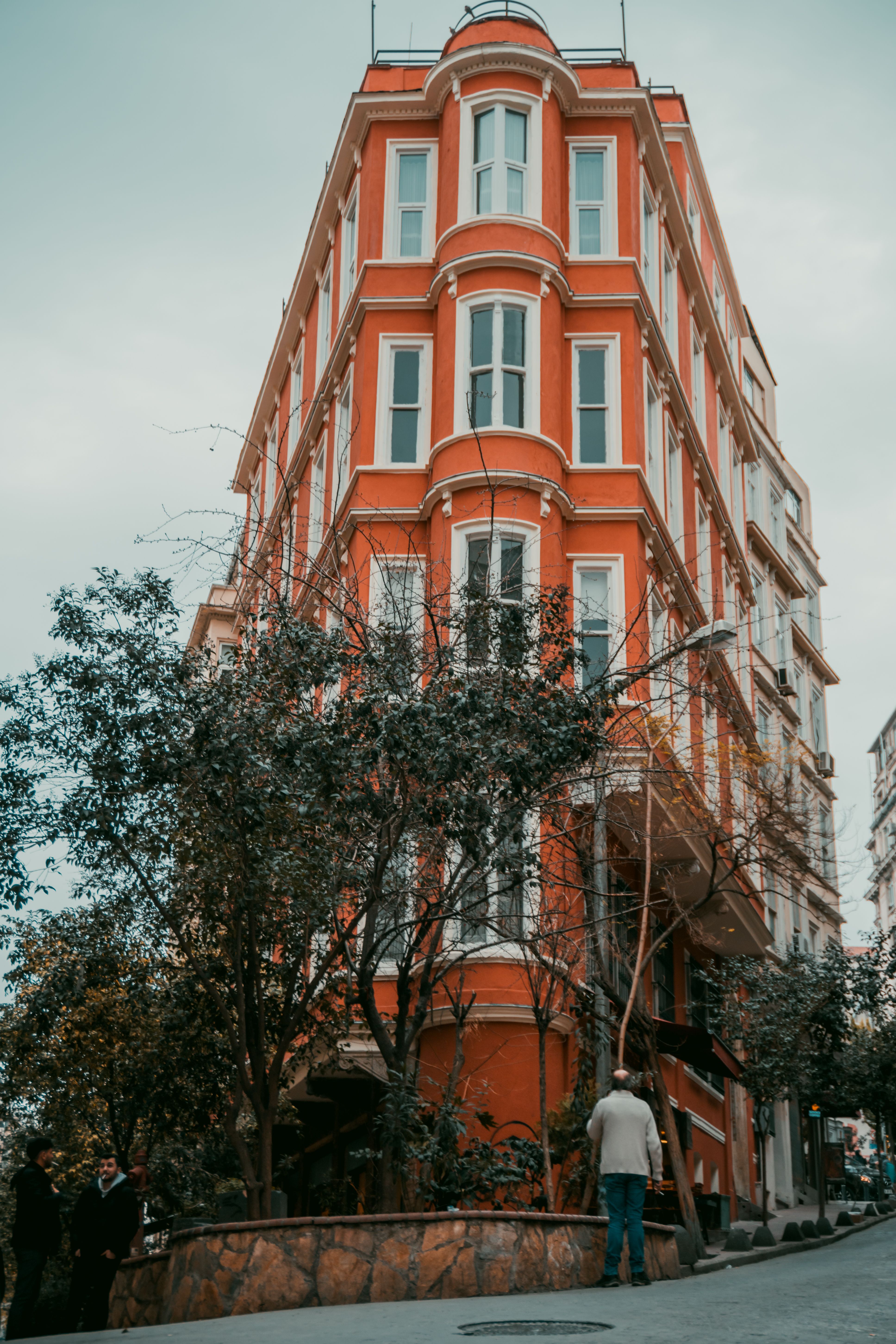 A building with orange and white windows on the side · Free Stock Photo